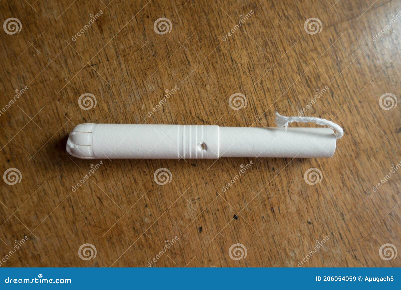 One Tampon with Cardboard Applicator on Wooden Table Stock Image ...
