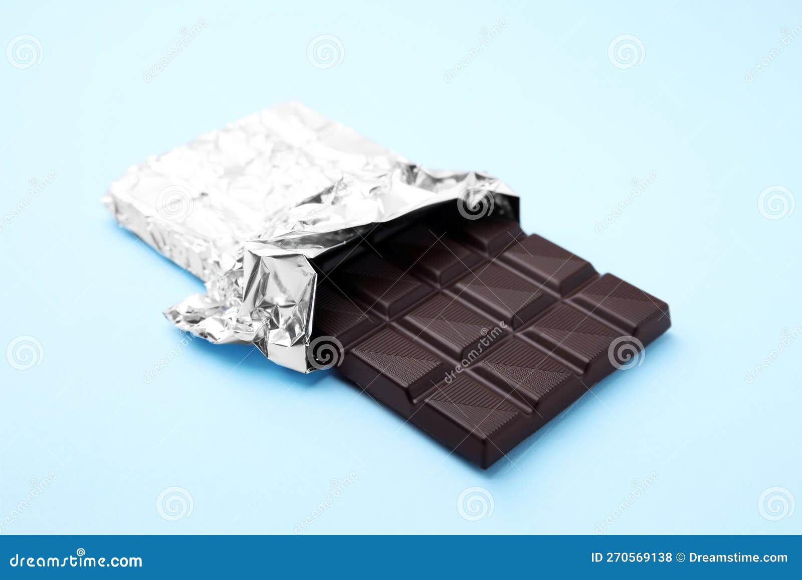 One Tasty Chocolate Bar on Light Blue Background Stock Photo - Image of ...