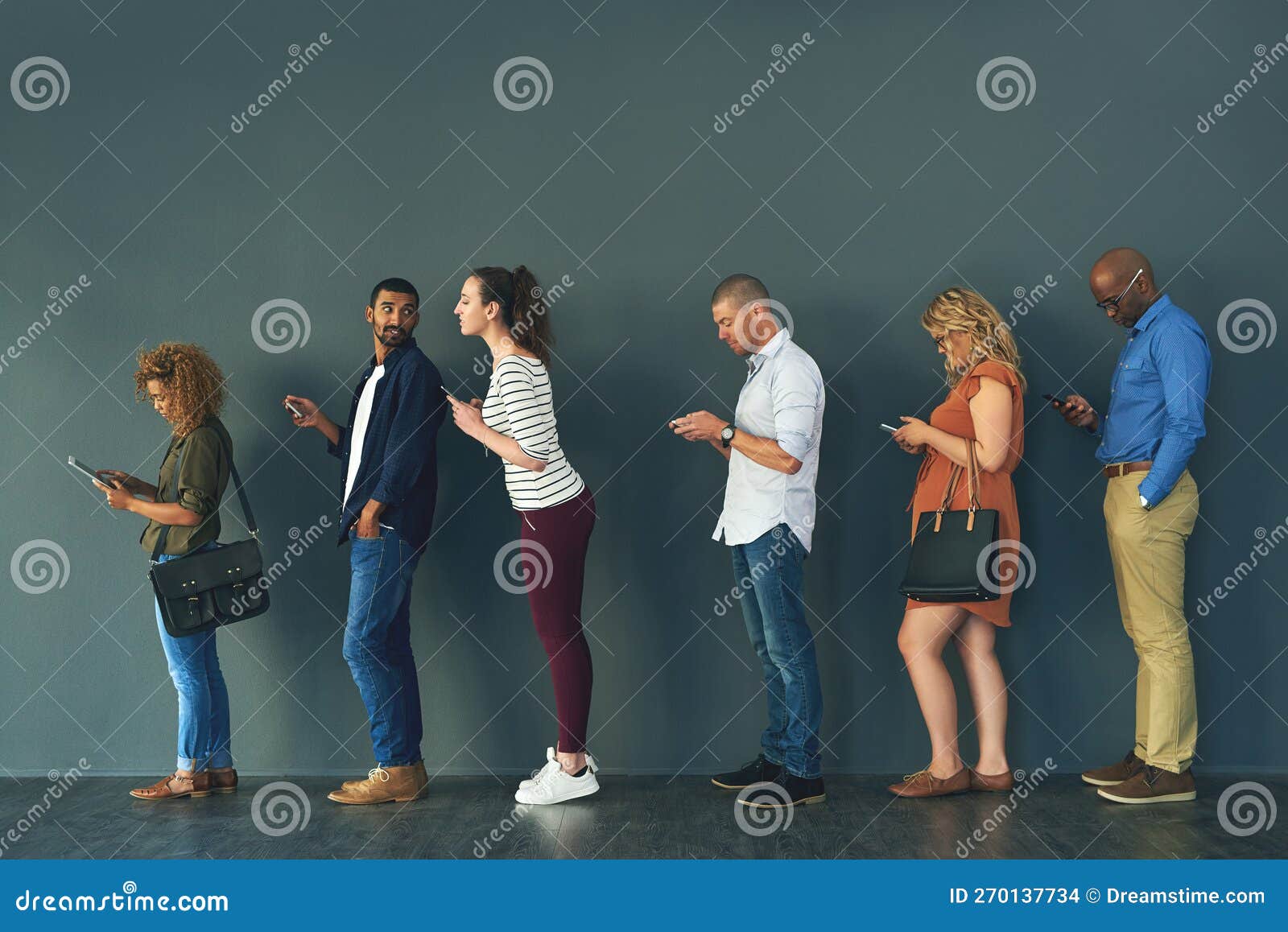We are One with Technology. a Group of People Standing in a Row Behind ...