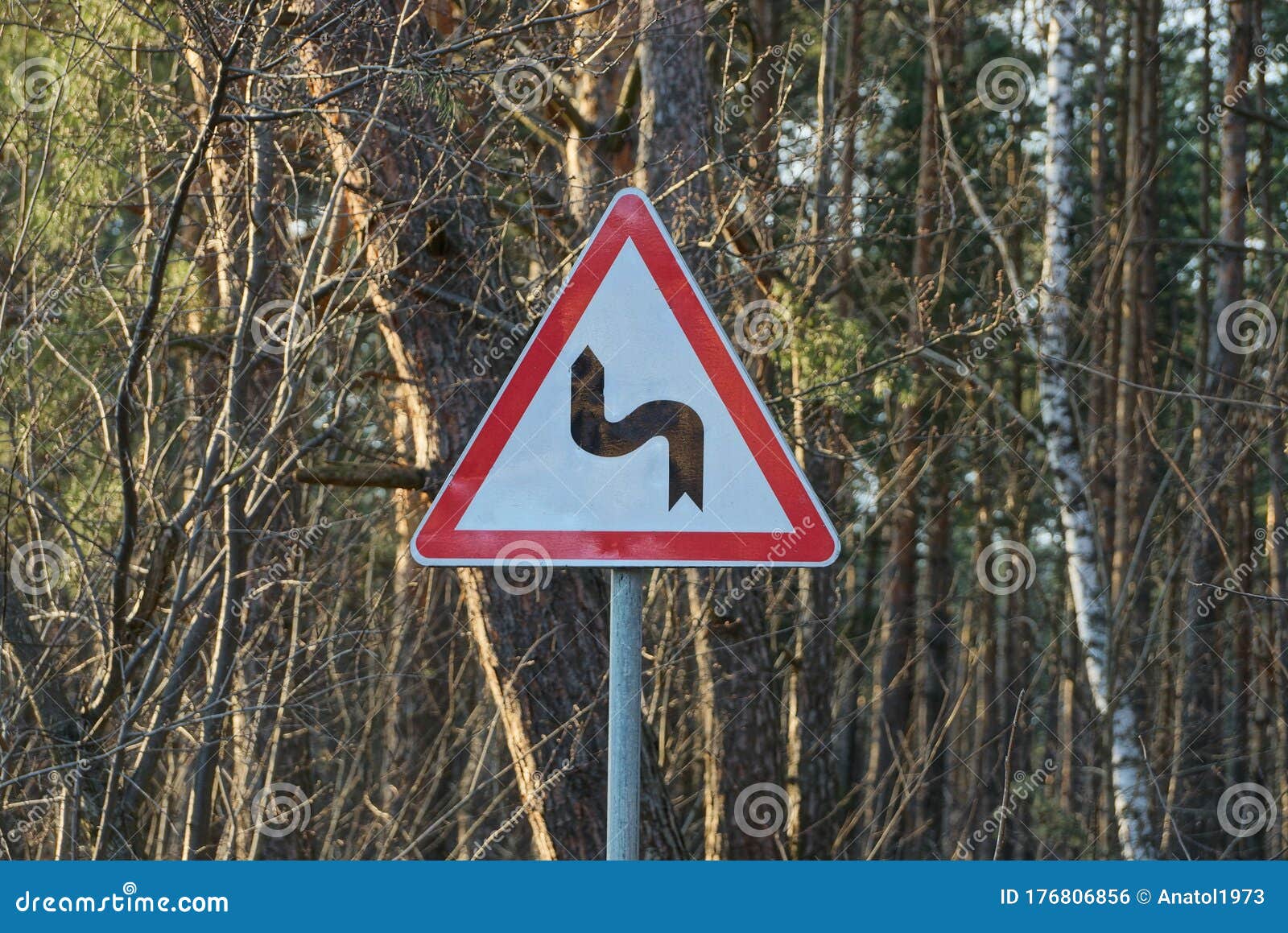 One Triangular Road Sign Dangerous Turn on a Pillar Stock Photo - Image ...