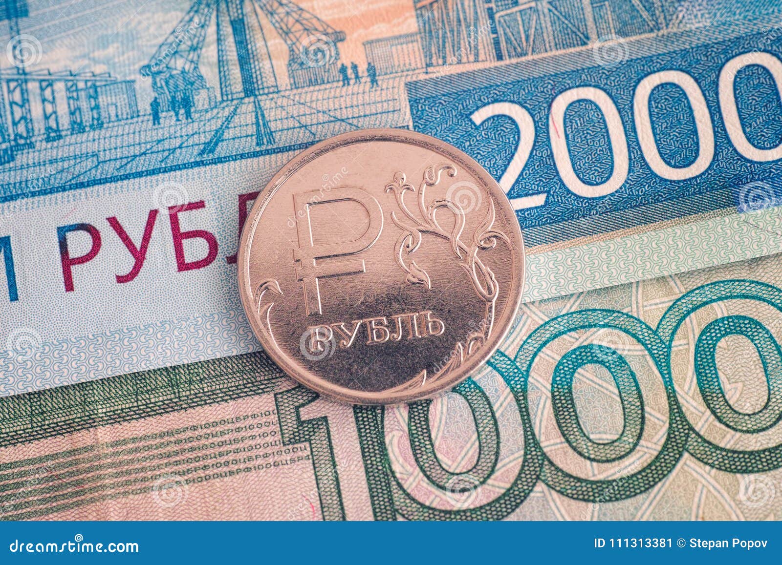 One and Two Thousand Ruble Banknotes and One-ruble Coin on it Stock ...