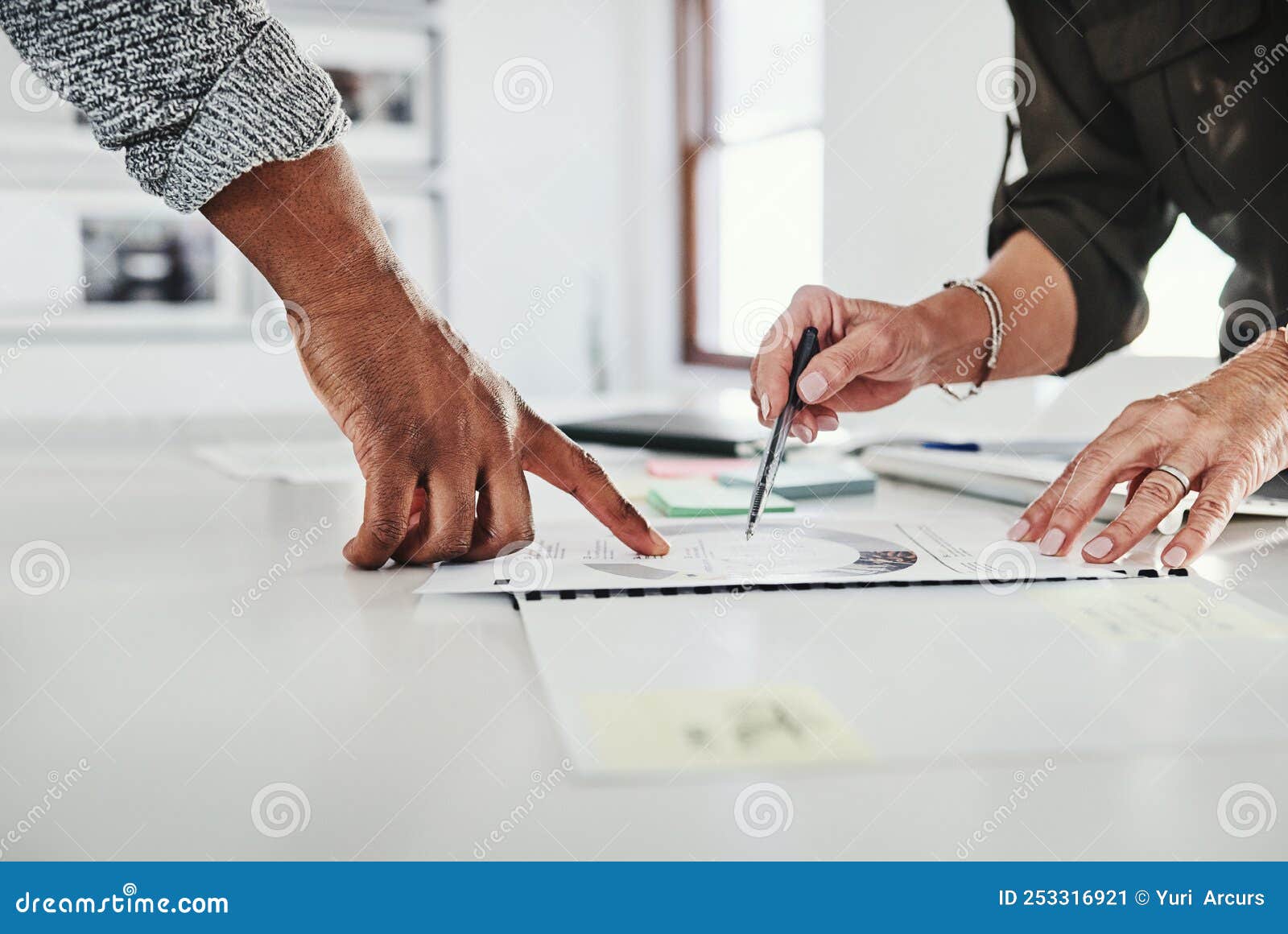 That One. Two Unrecognizable Businesspeople Working Together on ...