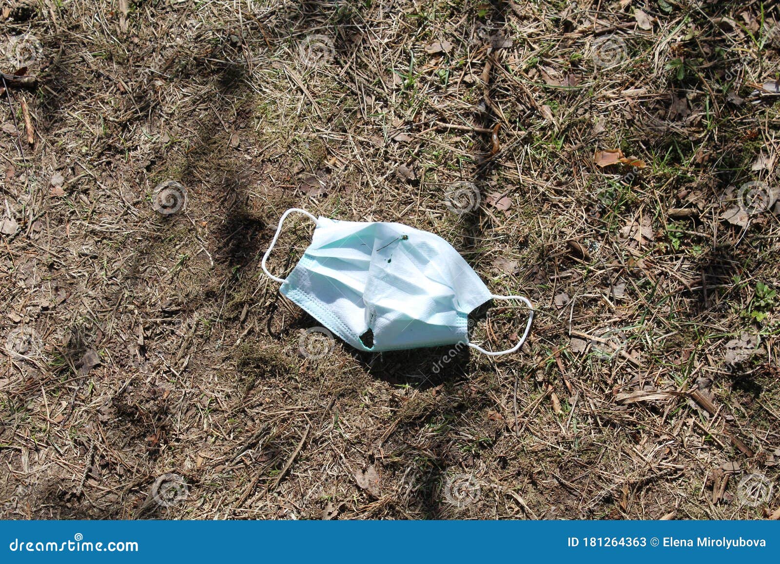 One Used Torn Medicine Mask Thrown on the Ground Stock Image - Image of ...