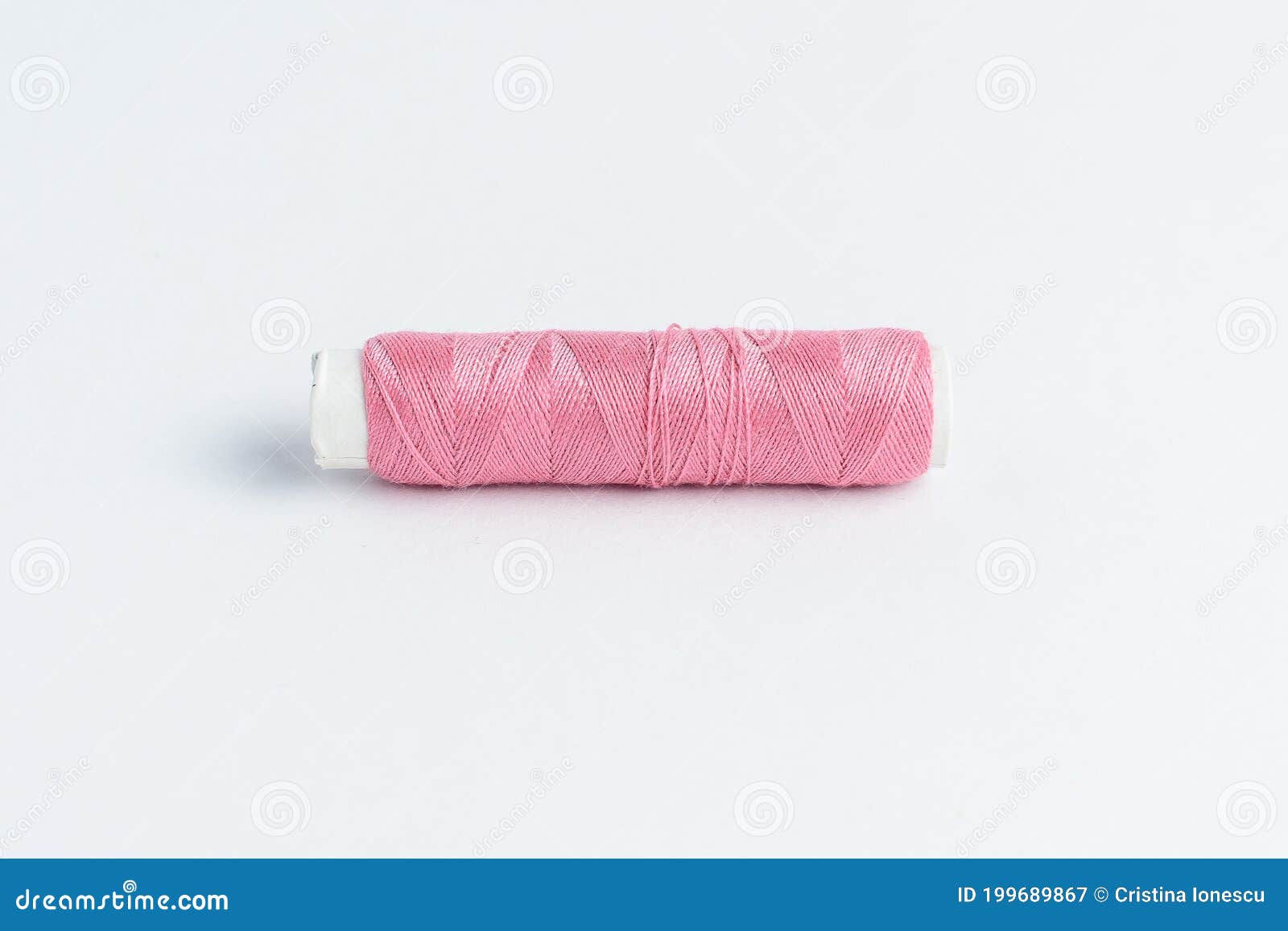 One Vivid Pink Cotton Spool of Thread Isolated on a White Table Stock ...
