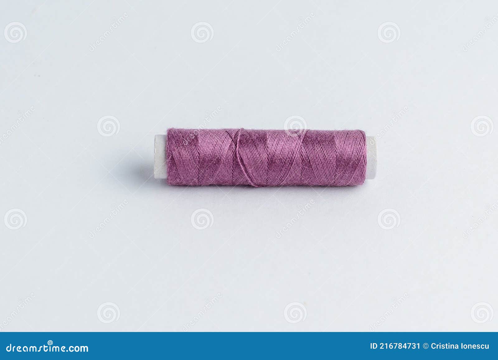 One Vivid Purple Cotton Spool of Thread Isolated on a White Table Stock ...