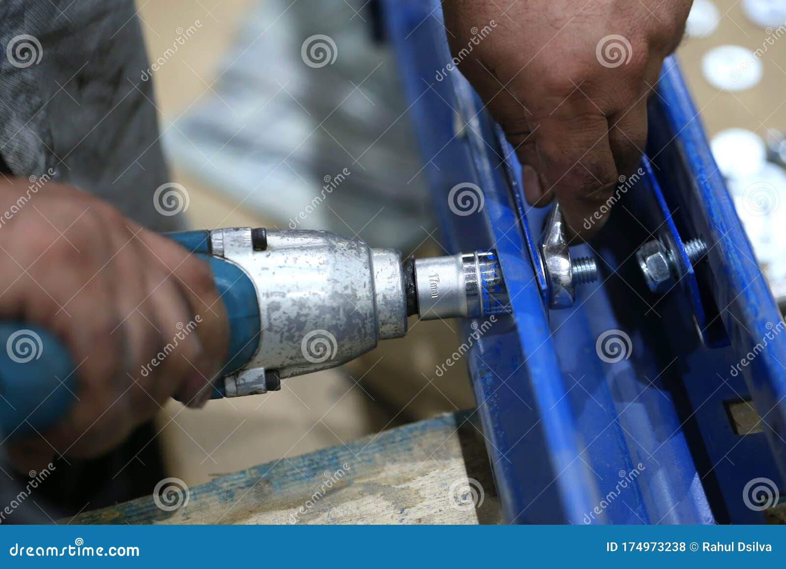 One Warehouse Worker in with Power Tool Tightening during Rack ...