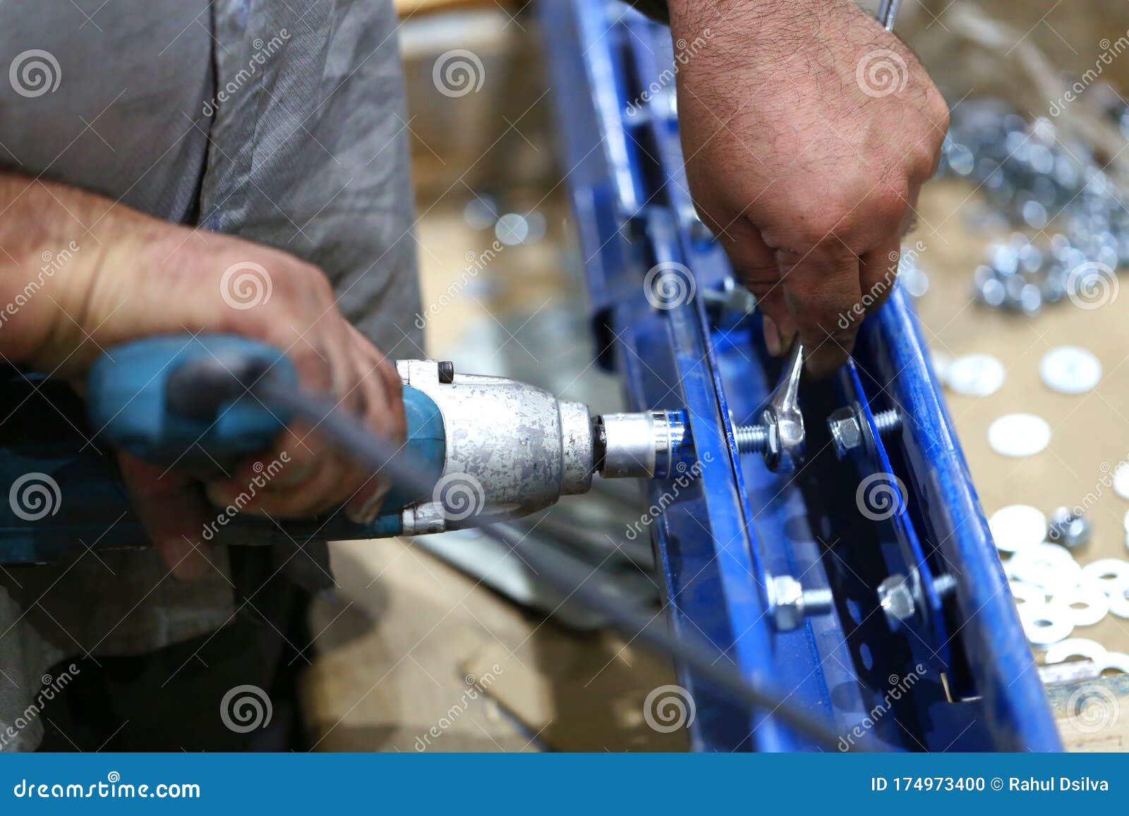One Warehouse Worker in with Power Tool Tightening during Rack ...