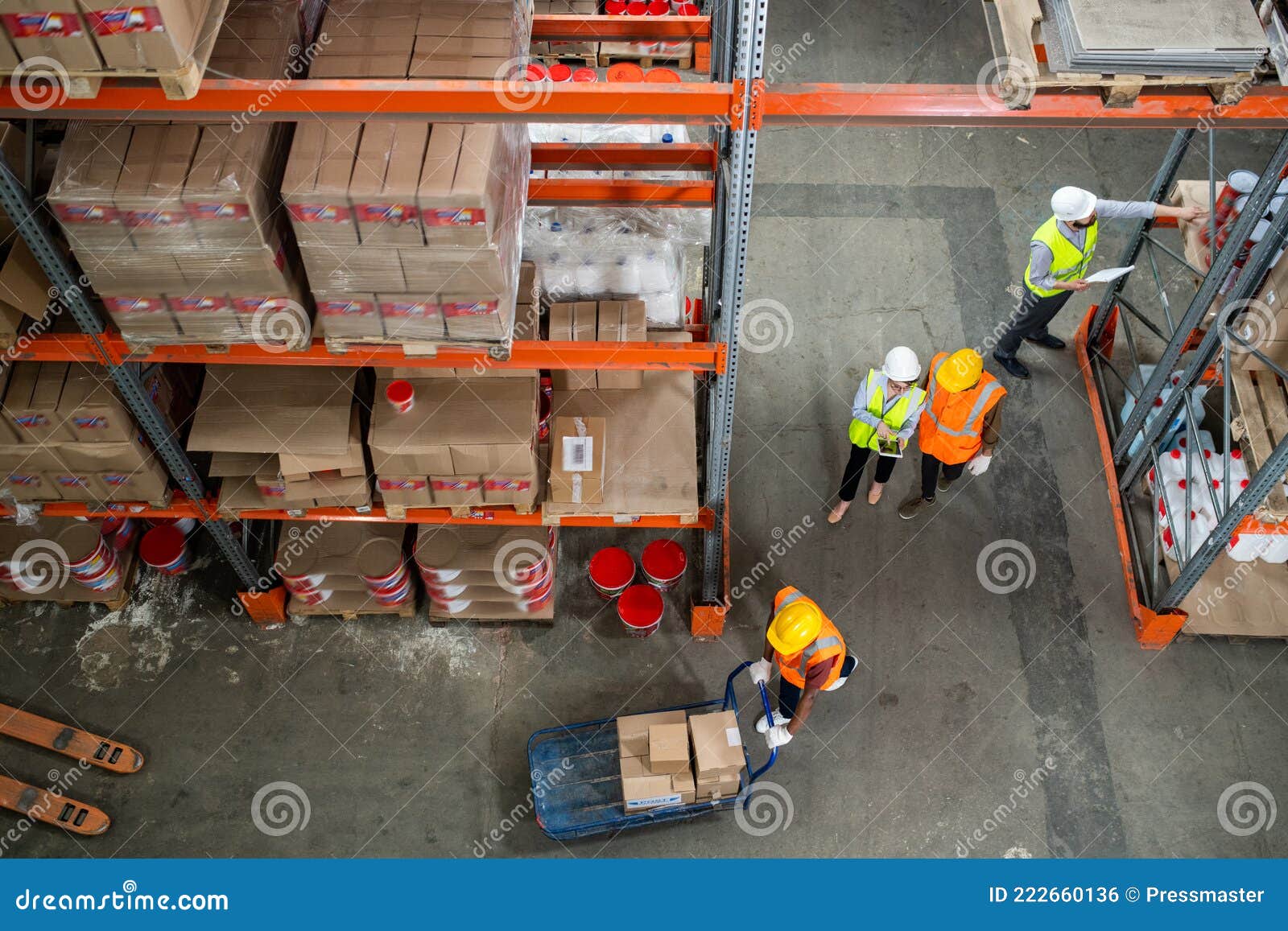 One of Warehouse Workers Pushing Cart with Boxes Stock Photo - Image of ...