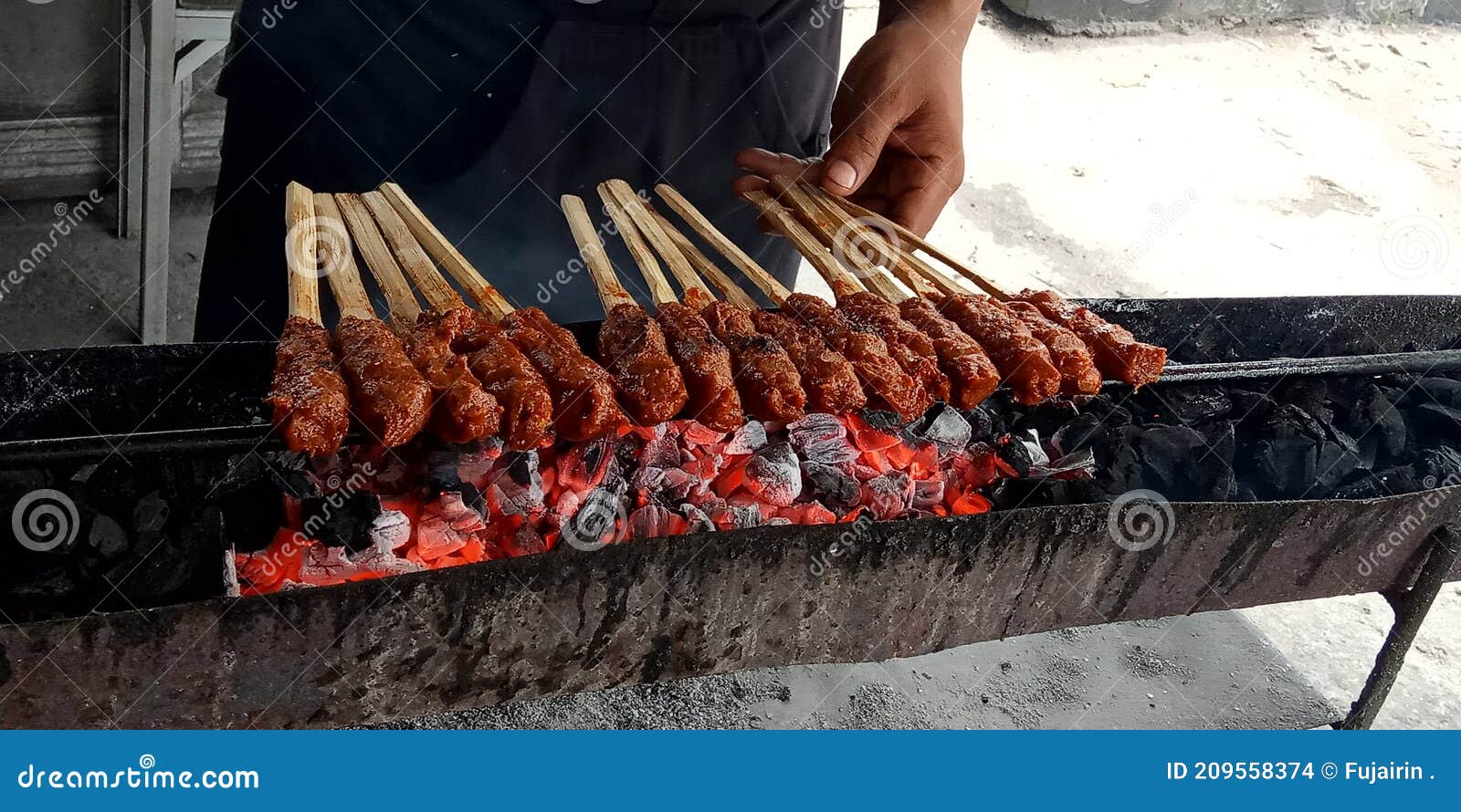 One Was Seen Grilling Fish Satay in a Bright and Catchy Color Stock ...