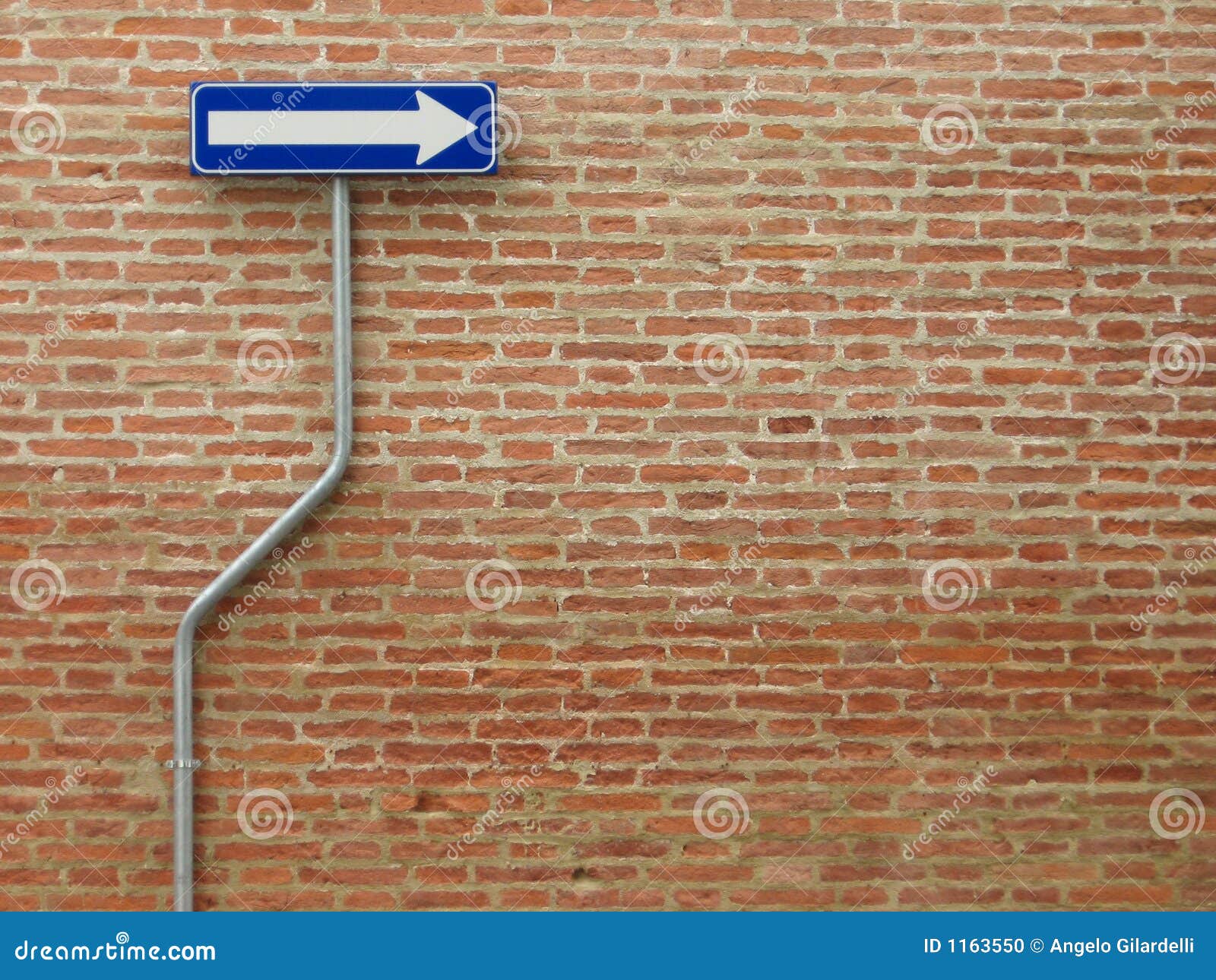 One Way Sign Over a Bricks Wall Stock Photo - Image of symbol ...