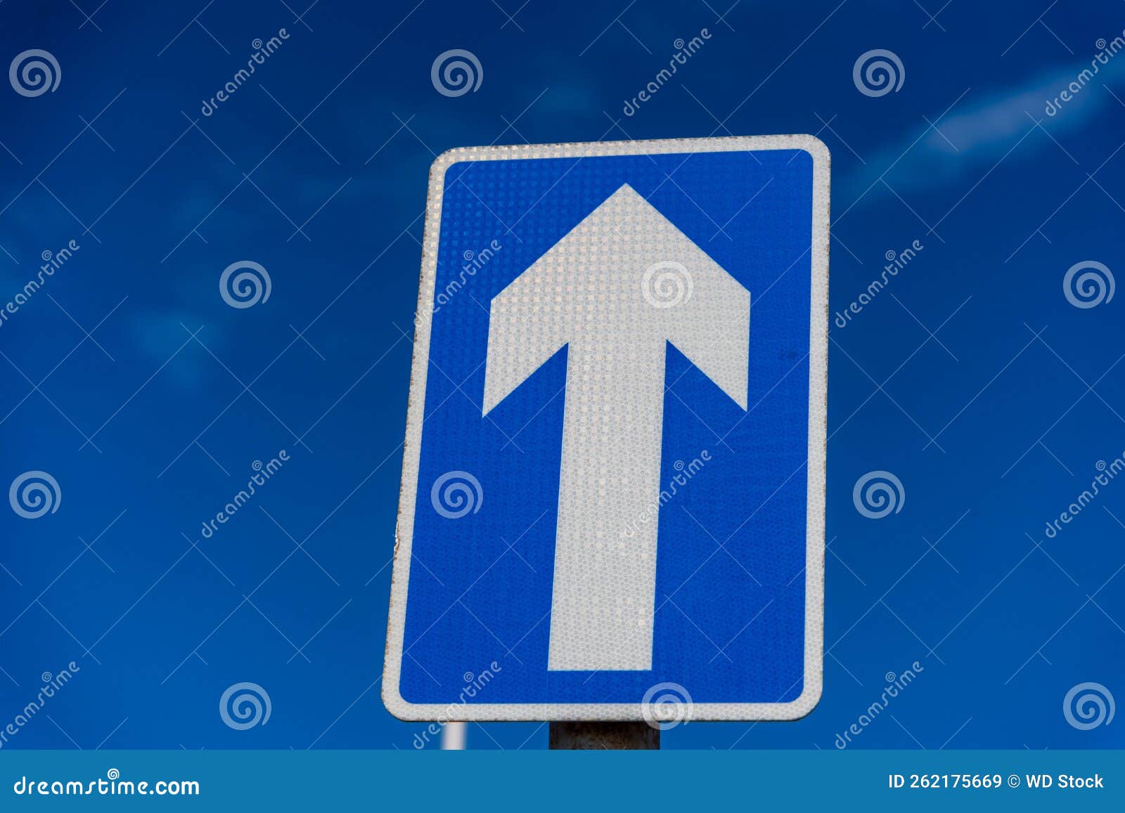 One Way Sign Set Against a Blue Sky Stock Image - Image of isolated ...