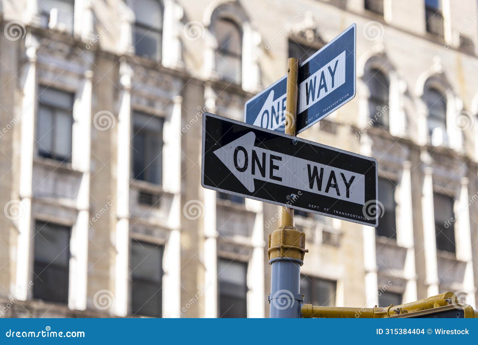 One Way Signs with a City Backdrop Stock Photo - Image of crossroad ...