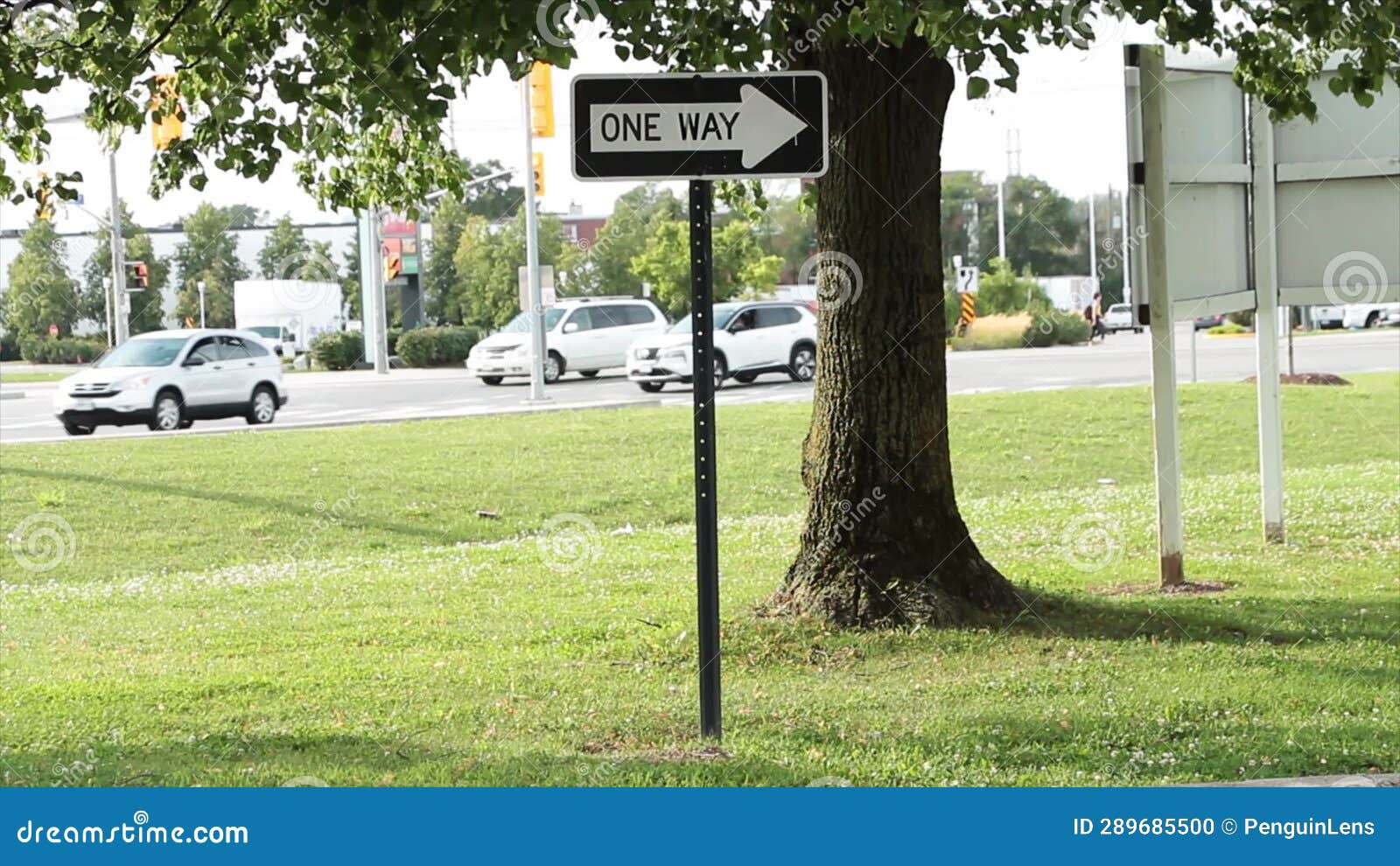 One Way White and Black Horizontal Rectangle Arrow Sign on Metal Post ...
