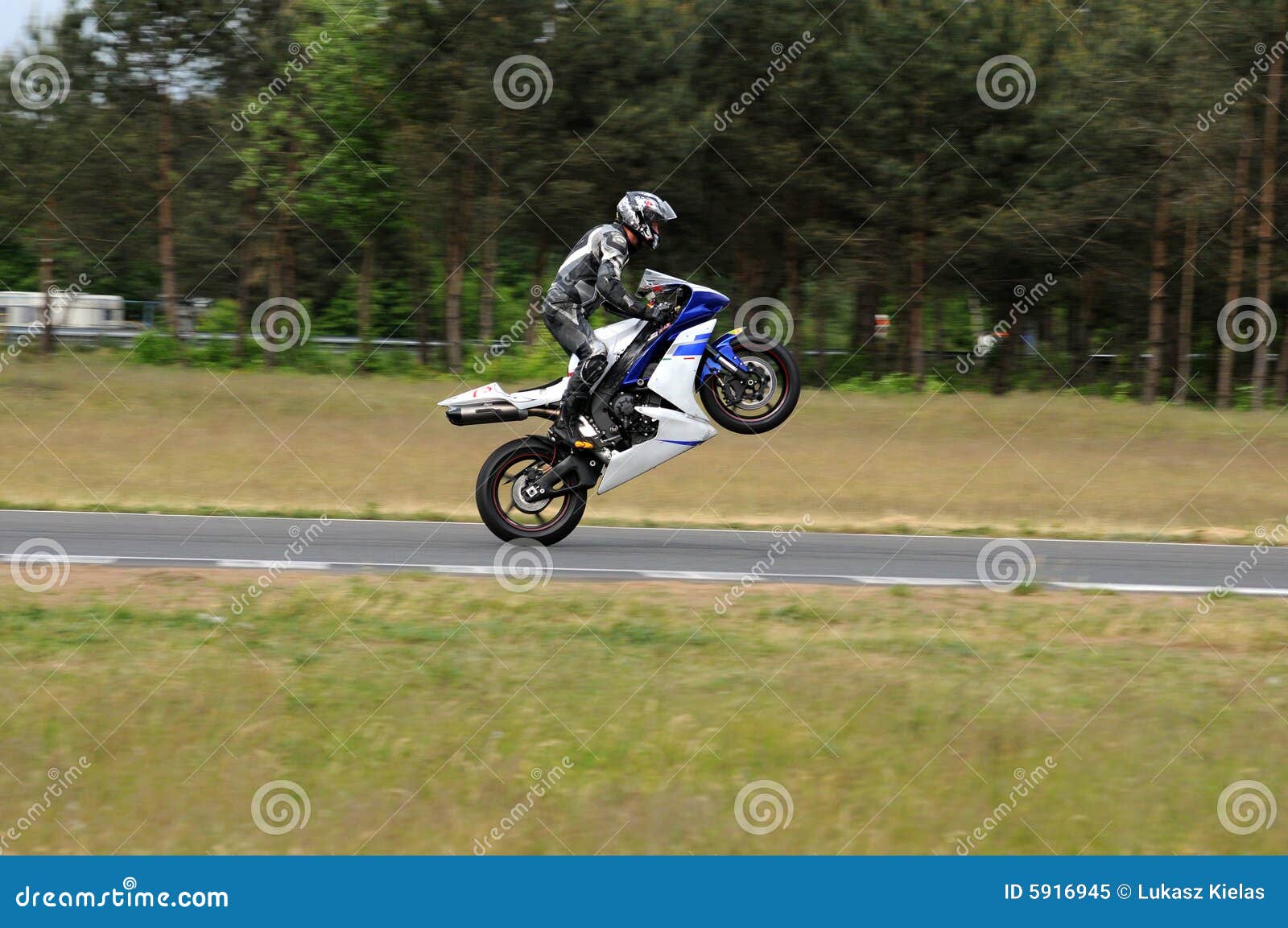 One wheel racing stock image. Image of motion, ride, brave - 5916945