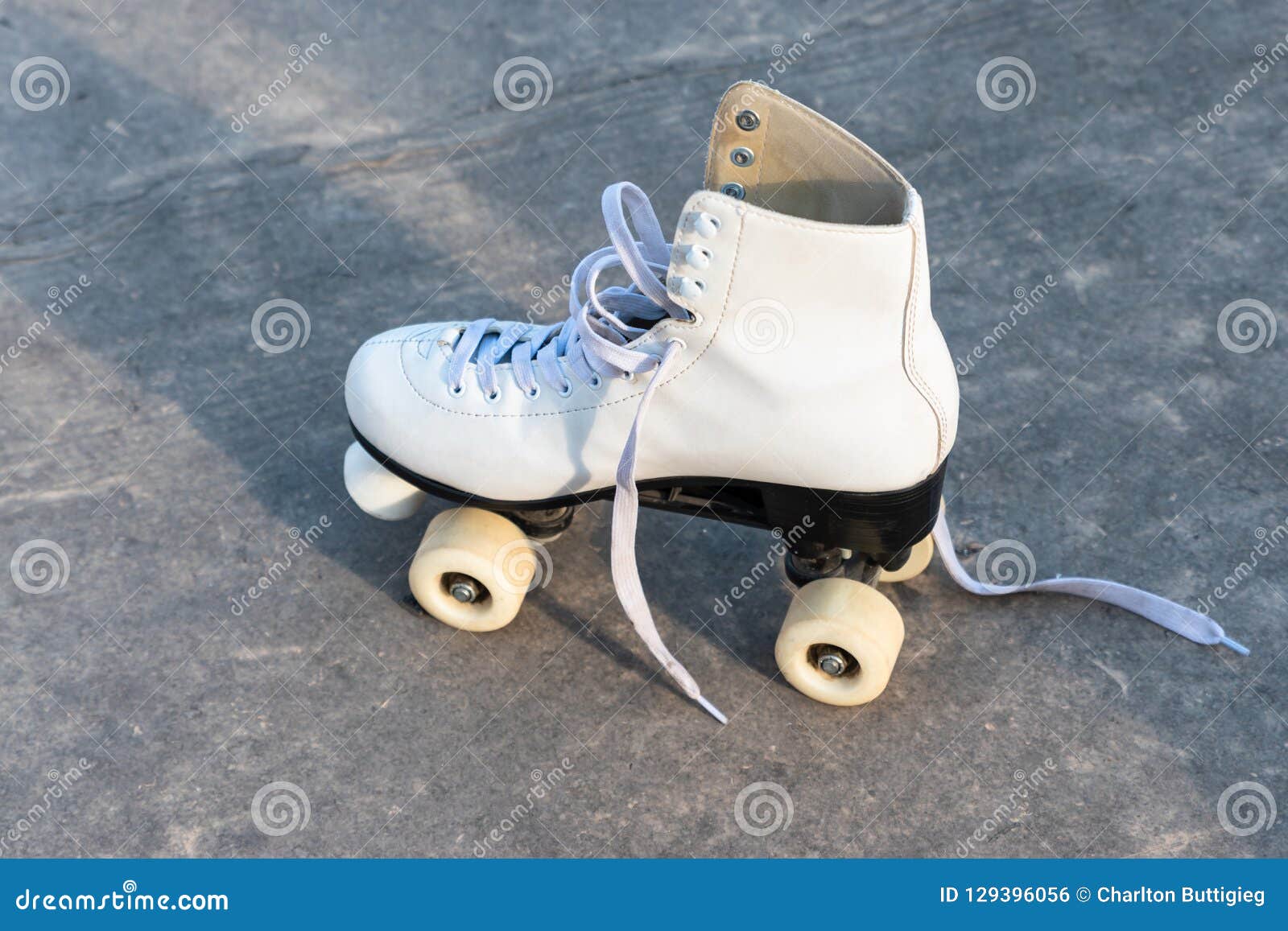 One White roller skates stock photo. Image of ladies - 129396056