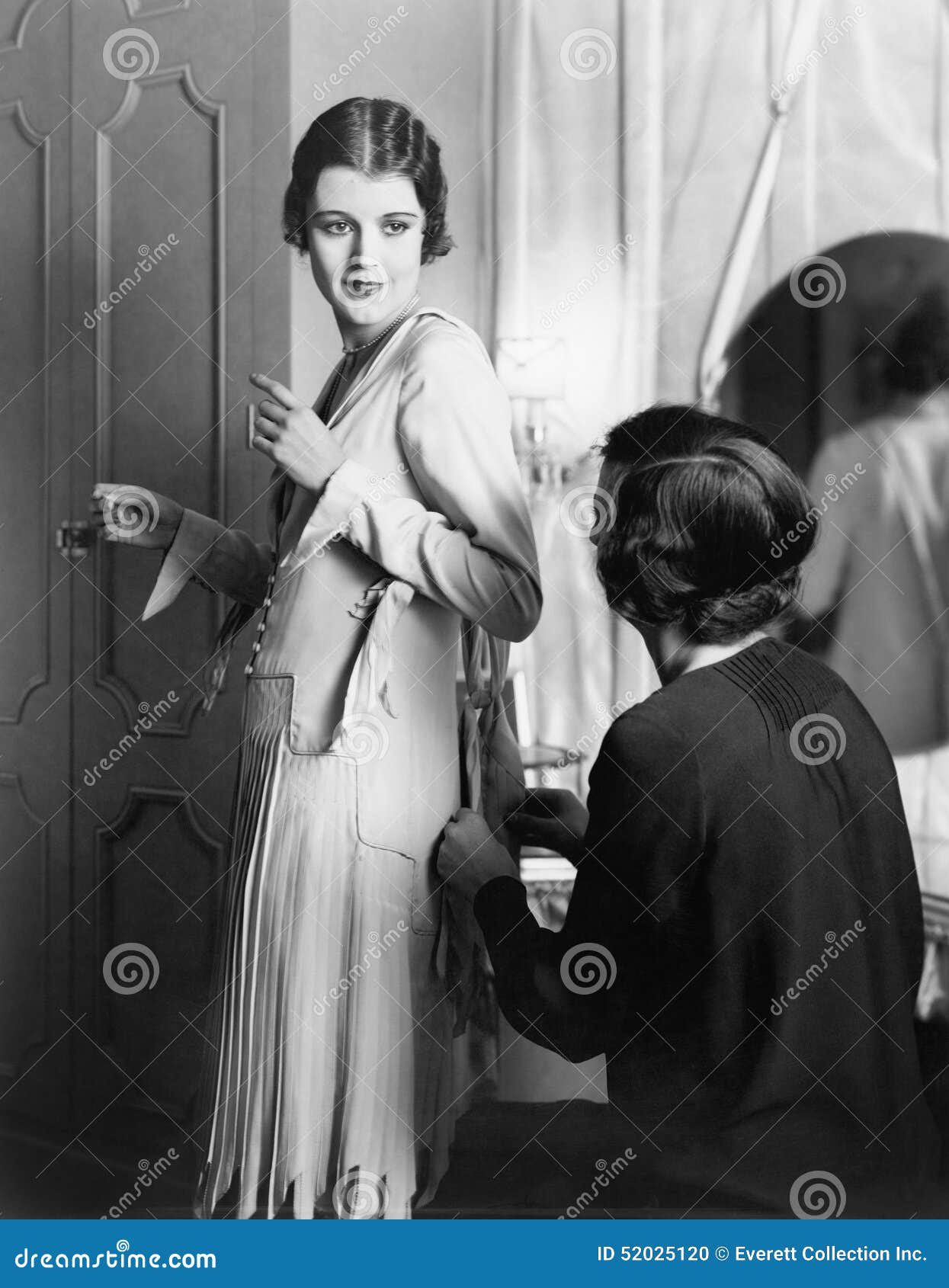 One Woman Helping Another Woman Getting Dressed Stock Photo - Image of ...