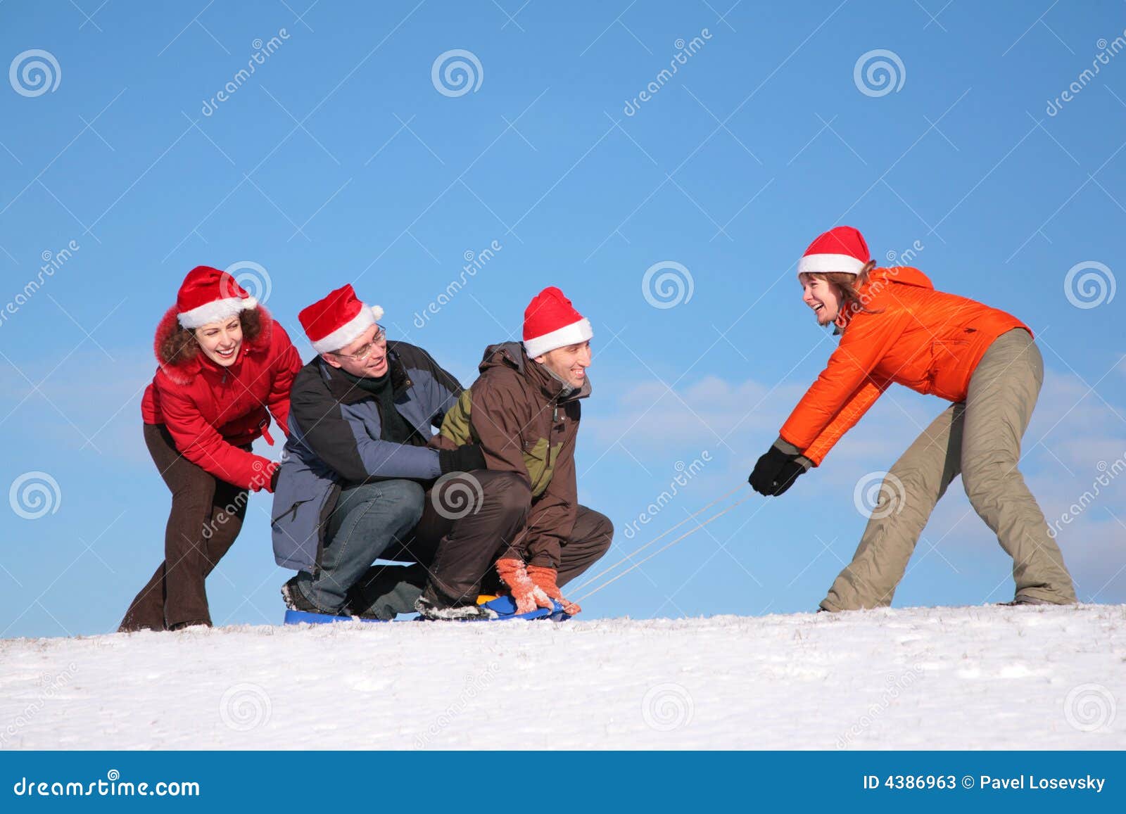 One Woman Pull Two Men on Sled Stock Image - Image of human, healthy ...