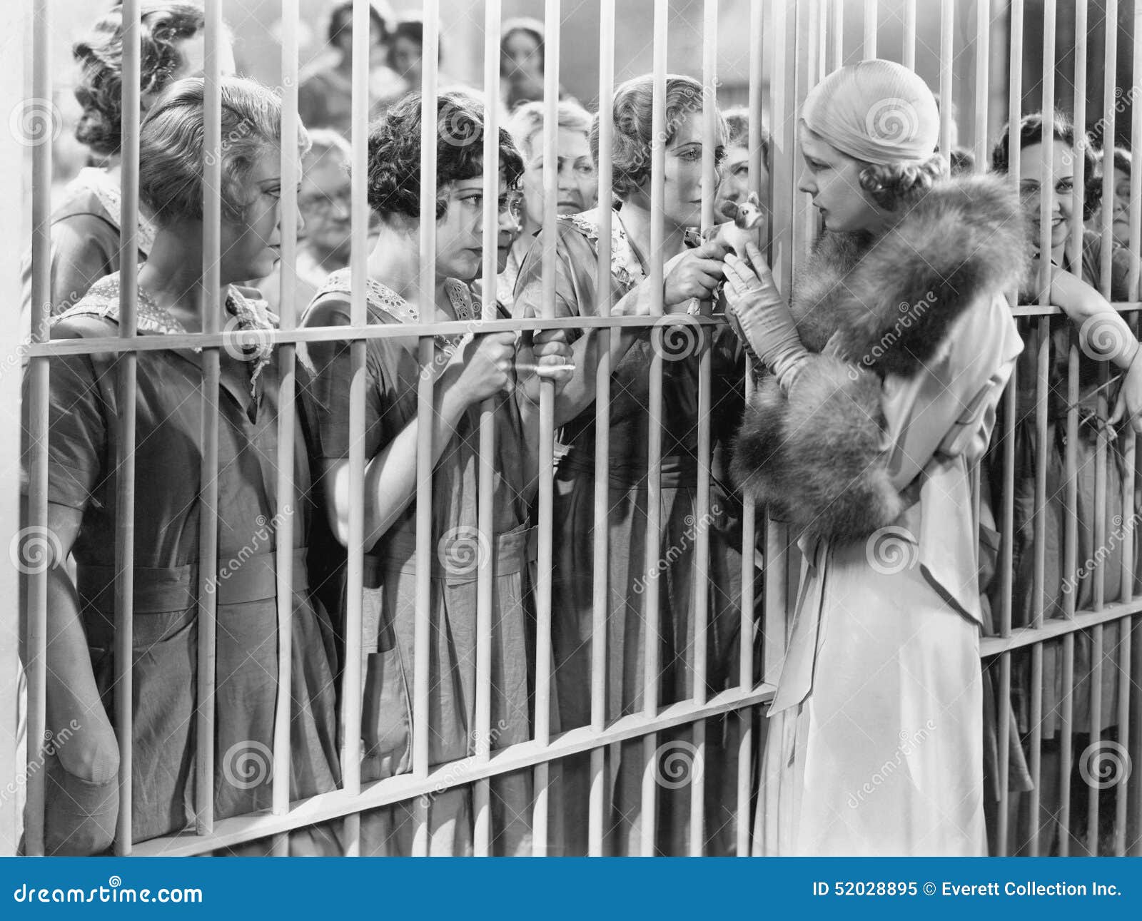 One Woman Standing in Front of a Jail Talking with a Group of Women ...