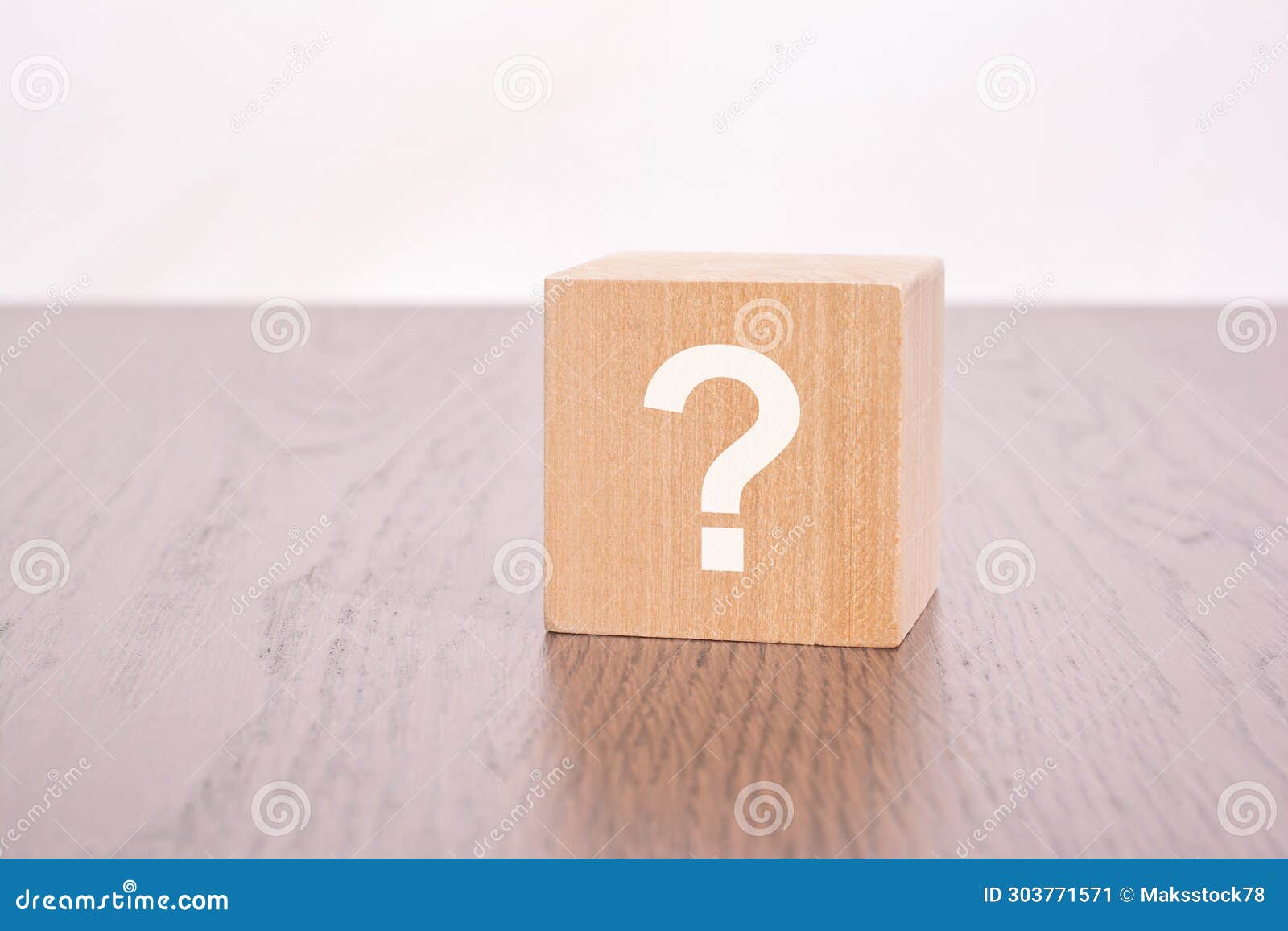 One Wooden Block with Question Mark Over a White Background with Copy ...