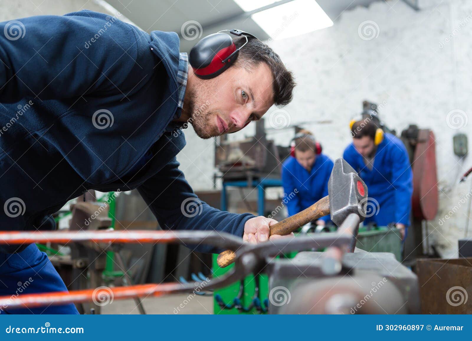 One Worker in Factory with Hammer on Work Bench Stock Image - Image of ...