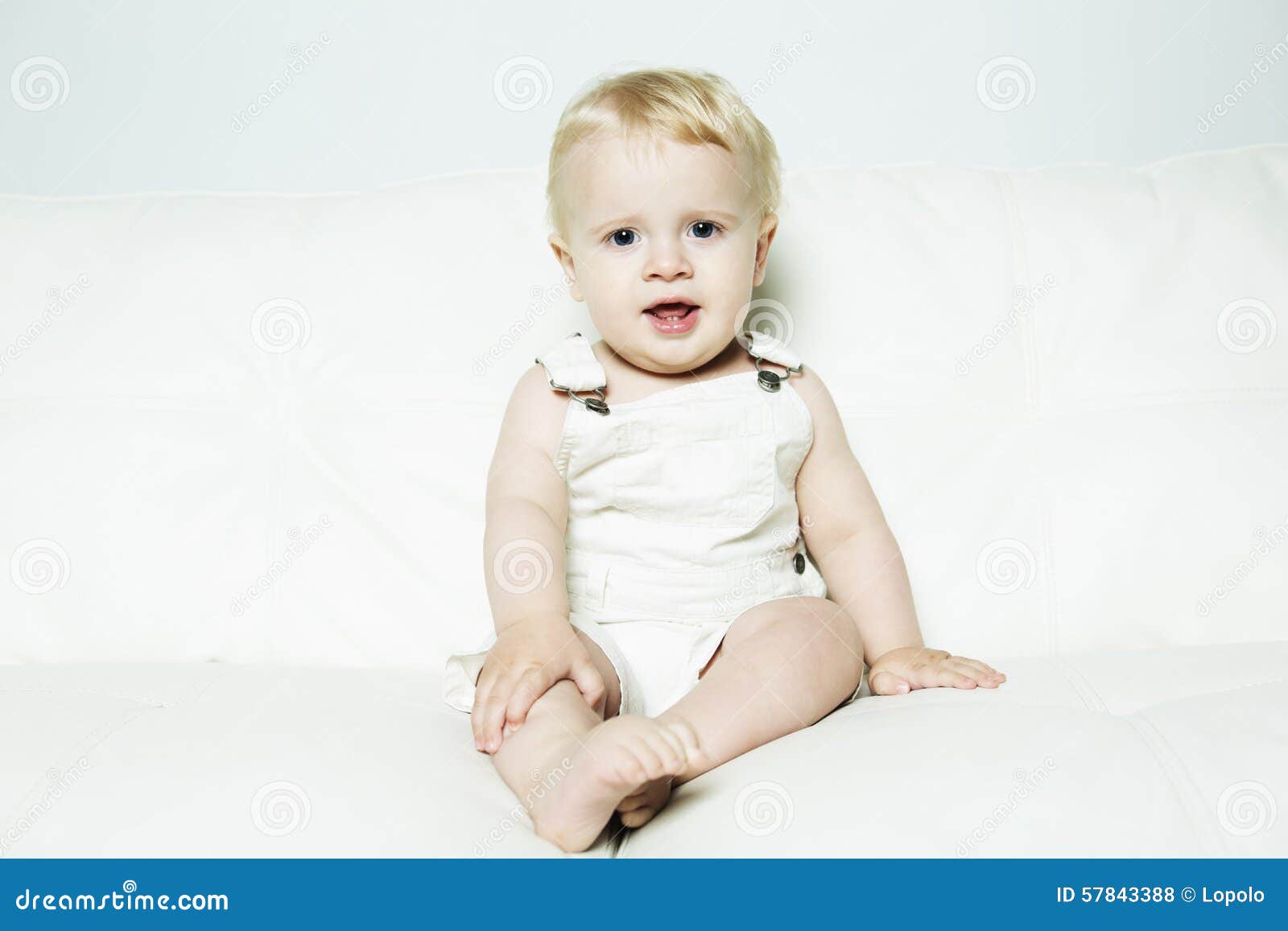 One-year-old Kid Learns on a Sofa Stock Photo - Image of small, cute ...