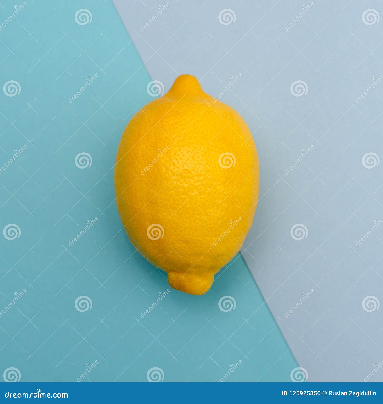 One Yellow Lemon on a Blue Background of Different Shades. the View ...