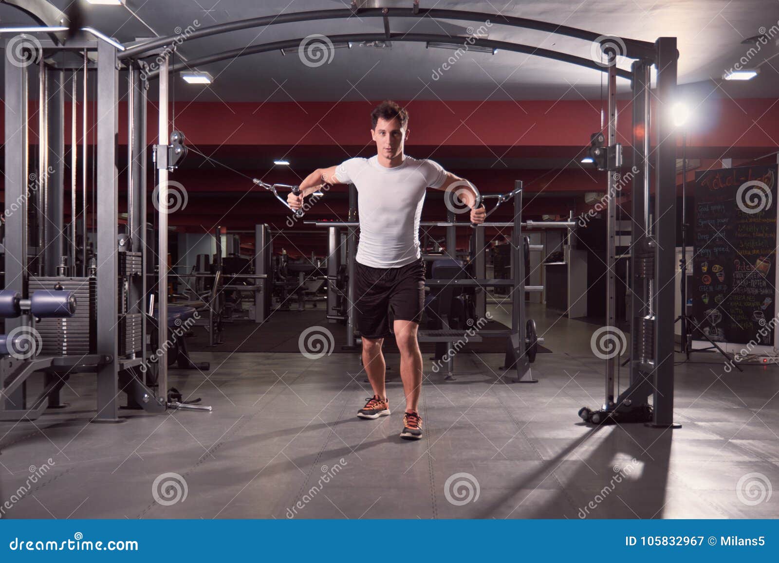 One Young Man, Multi-Station Gym Machine Cable Pull Exercise, Da Stock ...