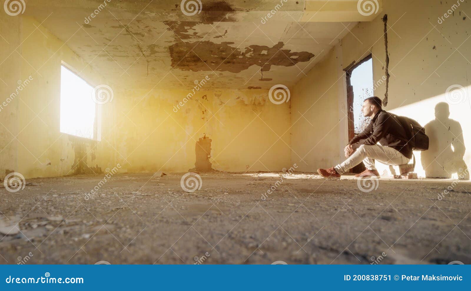 One Young Man Sitting in Empty Ruined Room Stock Image - Image of ...