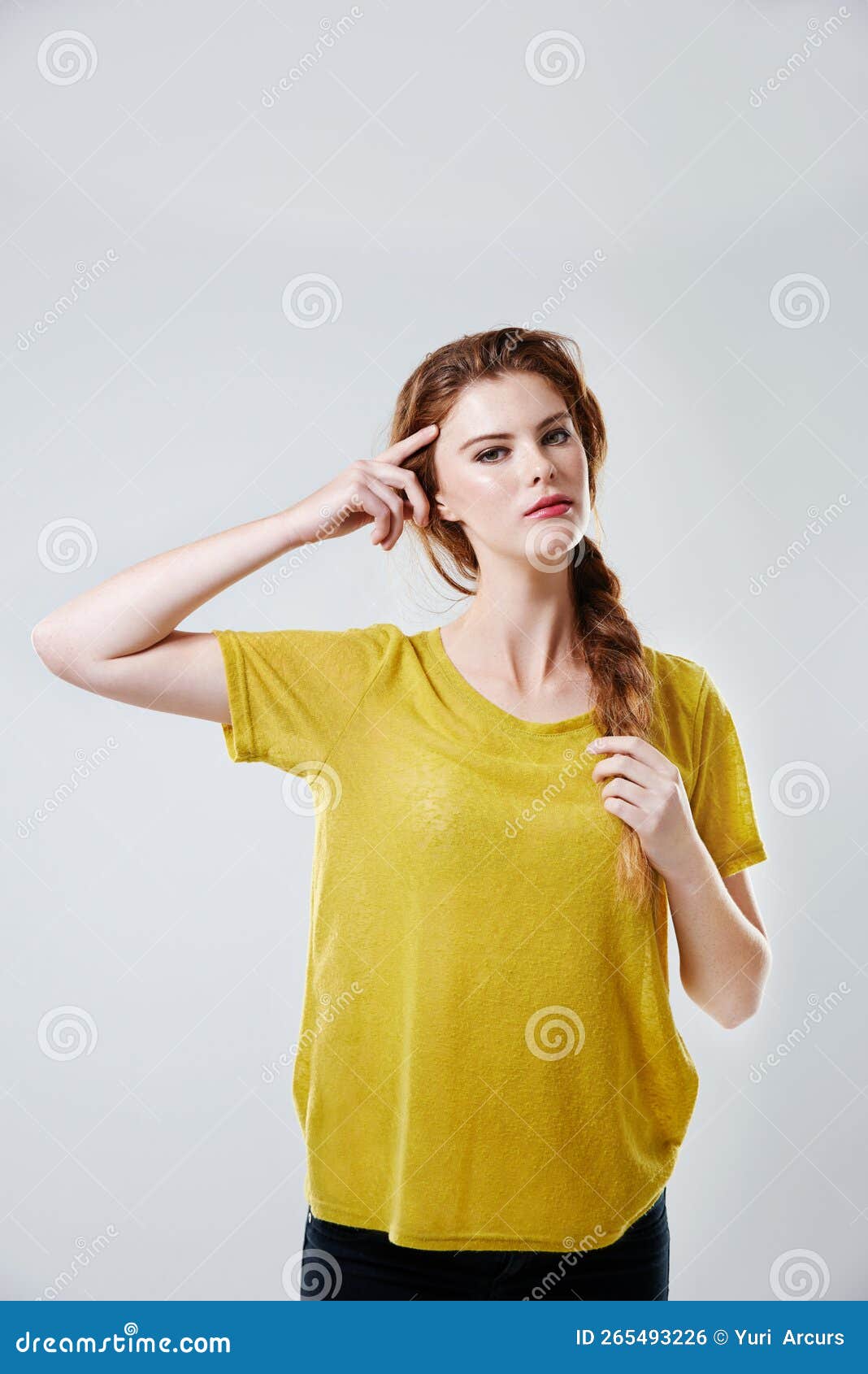 That Ones a Thinker. Studio Shot of a Casually Dressed Young Woman ...
