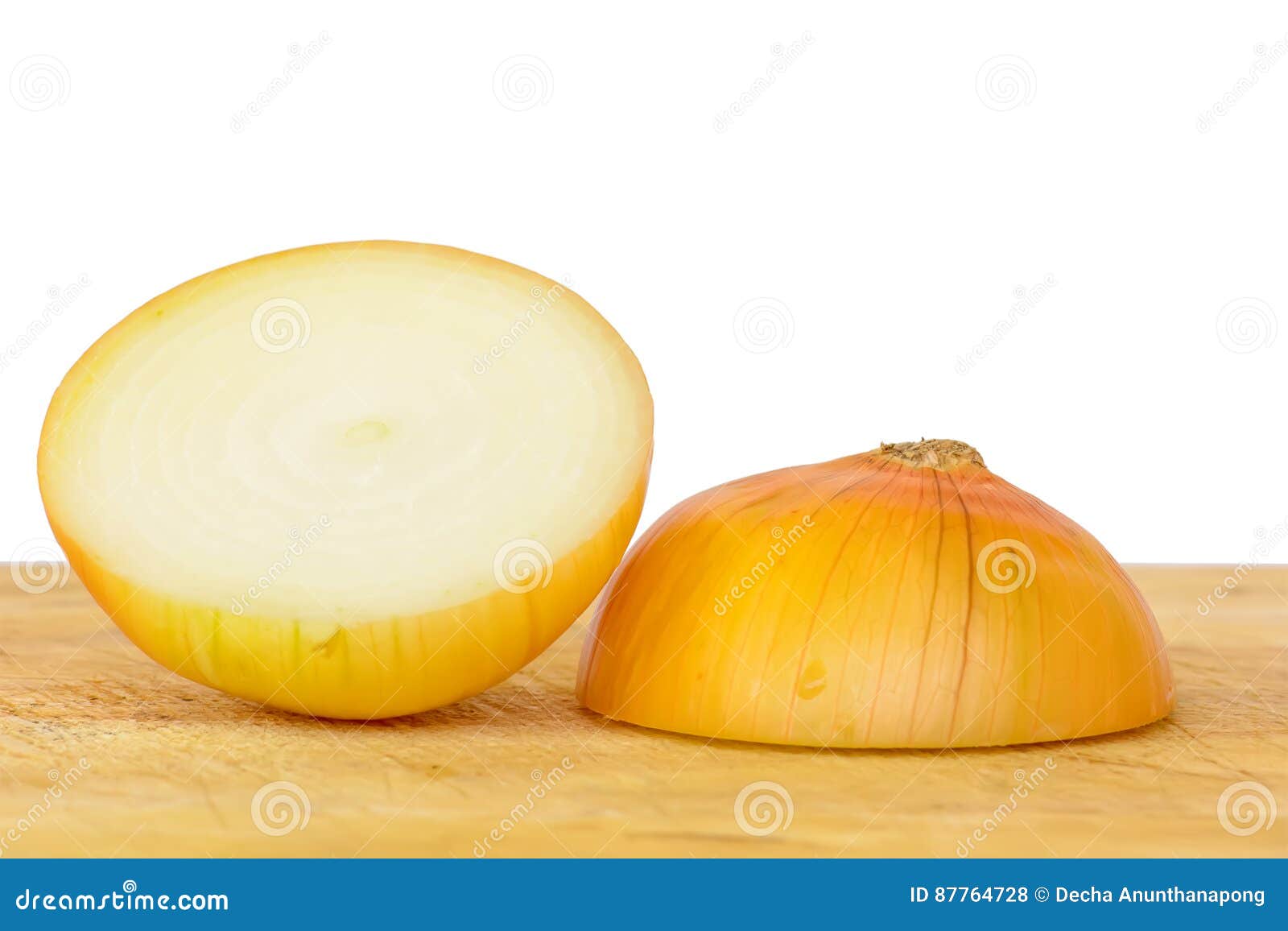 Onion Cut in Half on a Chopping Wood. Stock Photo - Image of gold ...