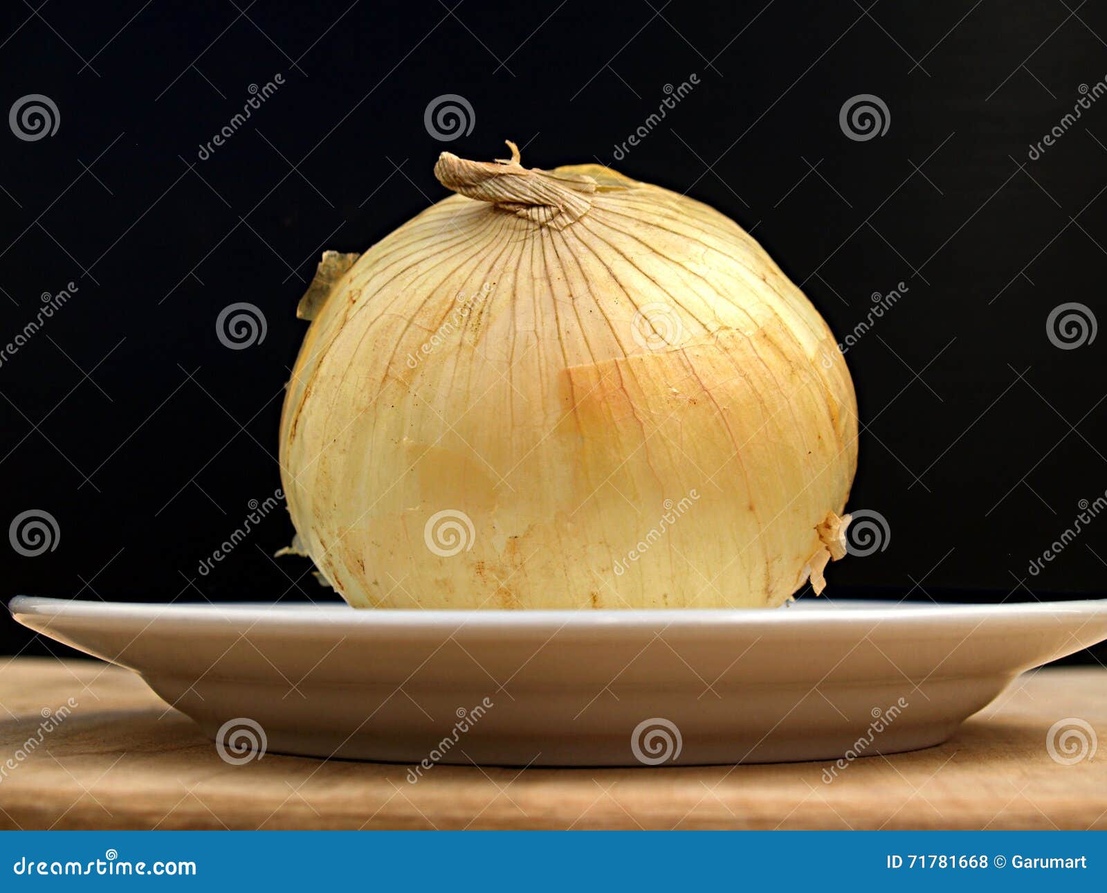 Onion on a plate stock photo. Image of object, ripe, bulb - 71781668