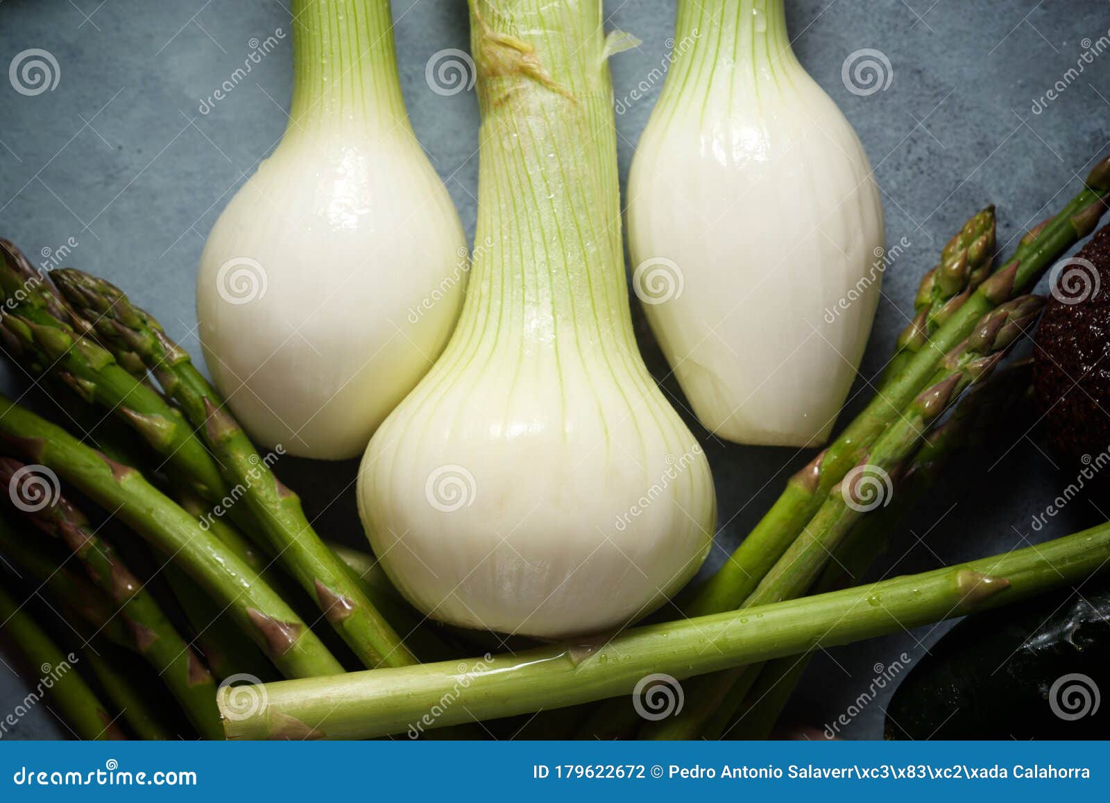 Onions on a table stock photo. Image of food, green - 179622672