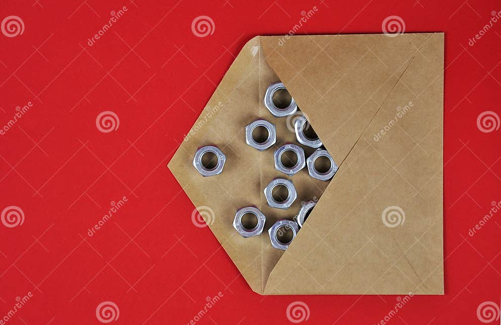 Postal Envelope and Metal Nuts Stock Image - Image of single, envelope ...