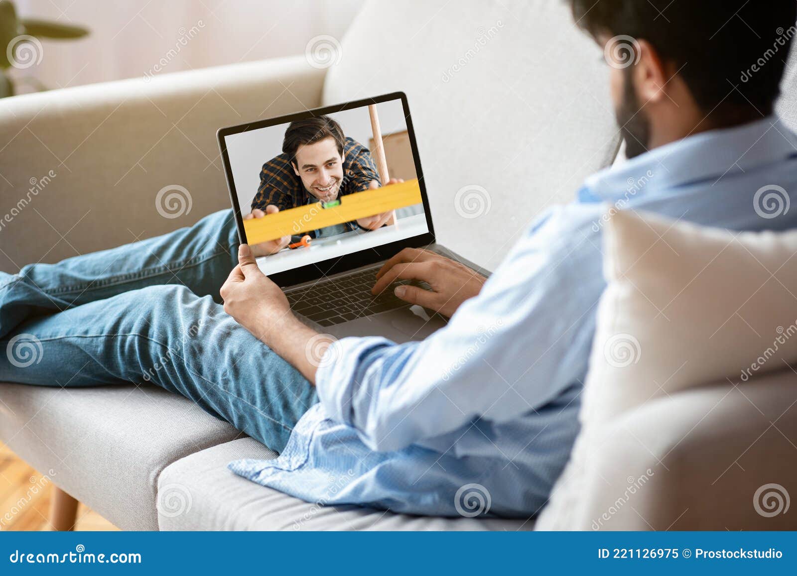 Young Guy Watching DIY Video Tutorial on Laptop, Learning How To Fix or ...