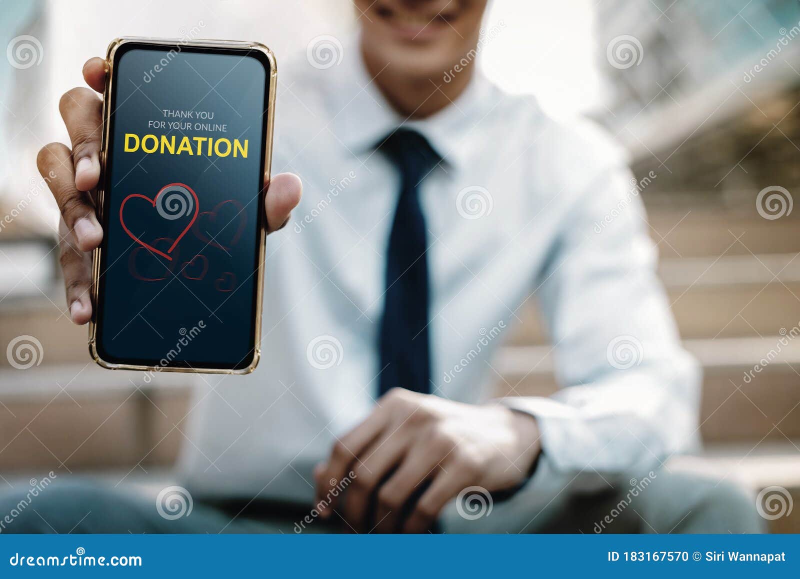 Online Donation Concept. Smiling Businessman Showing a Donate Message ...