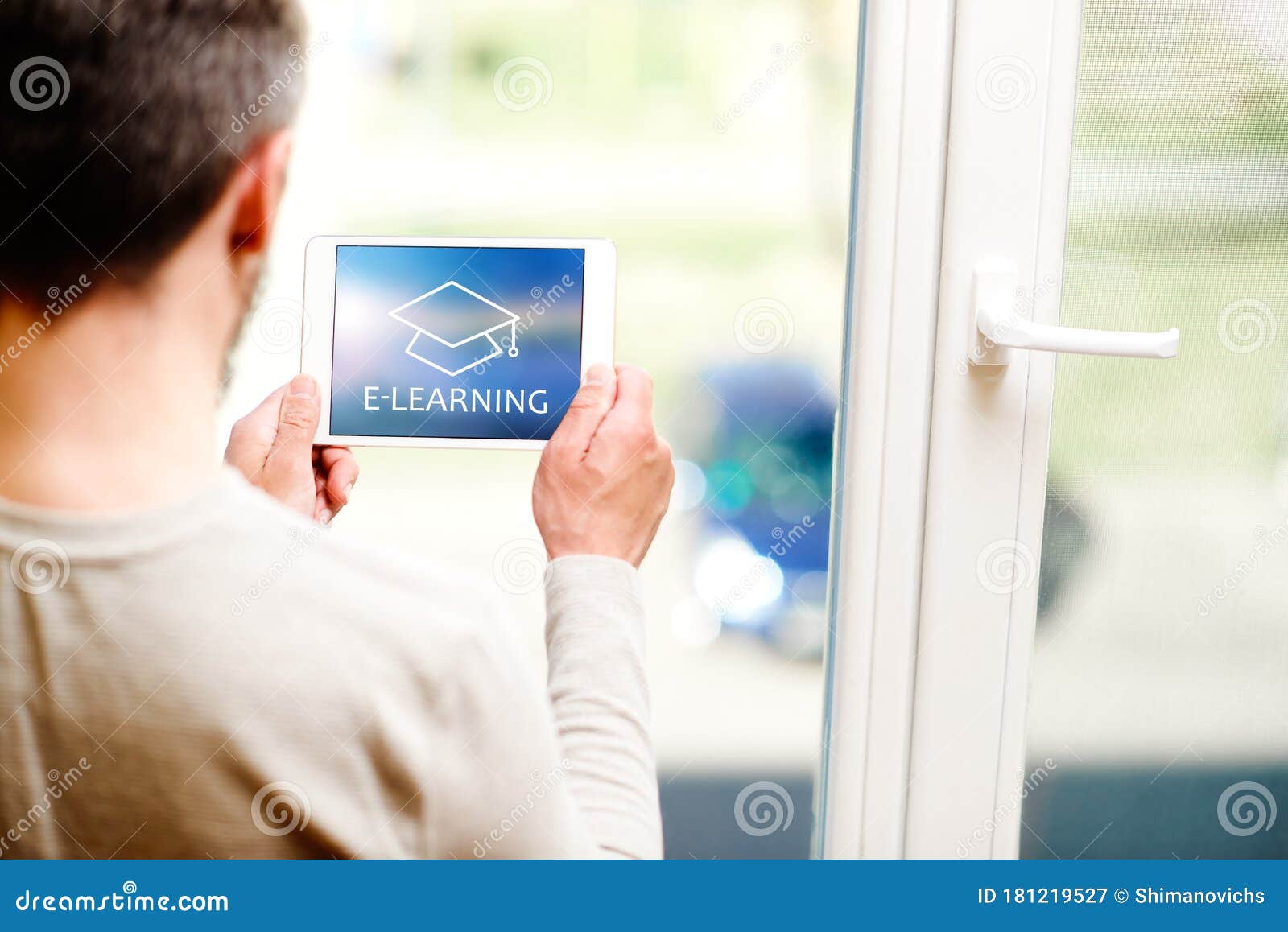 Online Education, E-learning. a Man Works on a Tablet on the Screen of ...