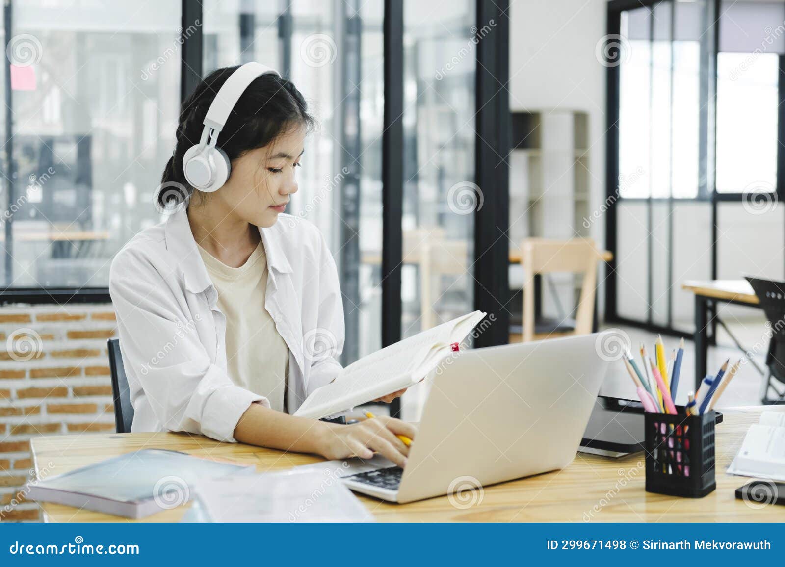 Young Collage Student Using Computer and Mobile Device Studying Online ...