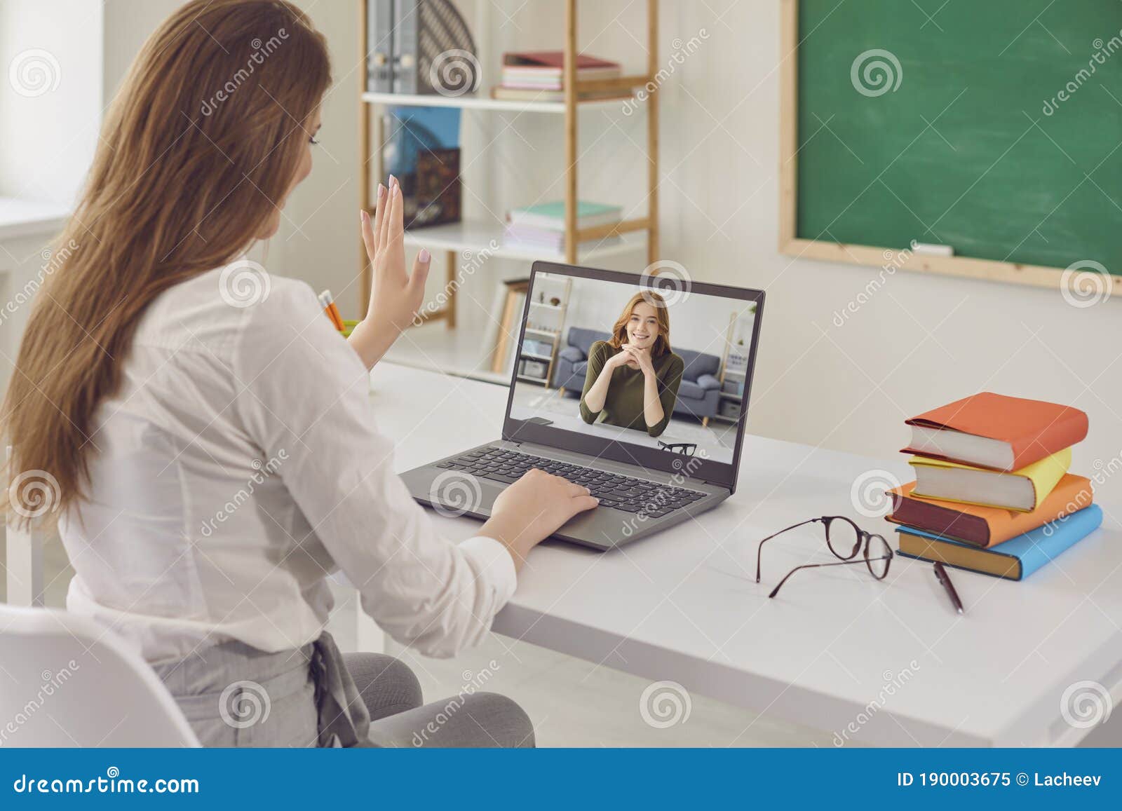 Online Education. Teacher Talks with Student Using Laptop Webcam in ...