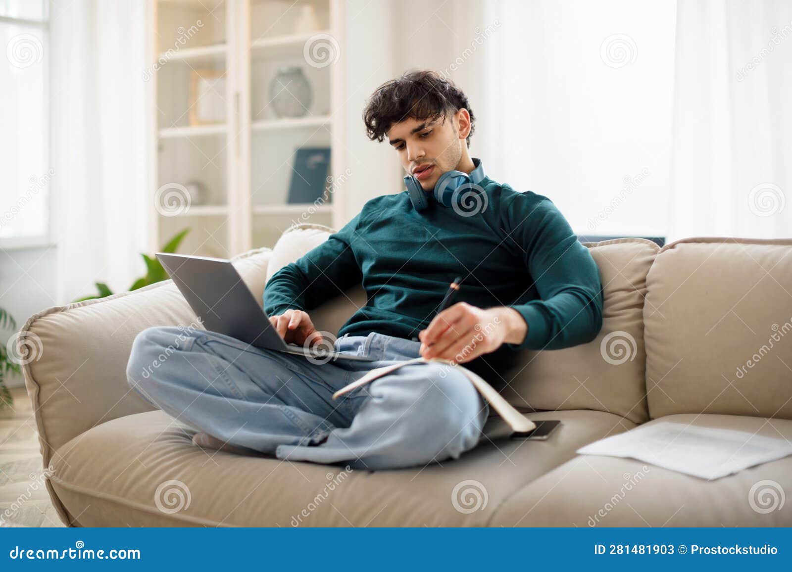 Middle Eastern Guy Studying with Laptop at Home Taking Notes Stock ...