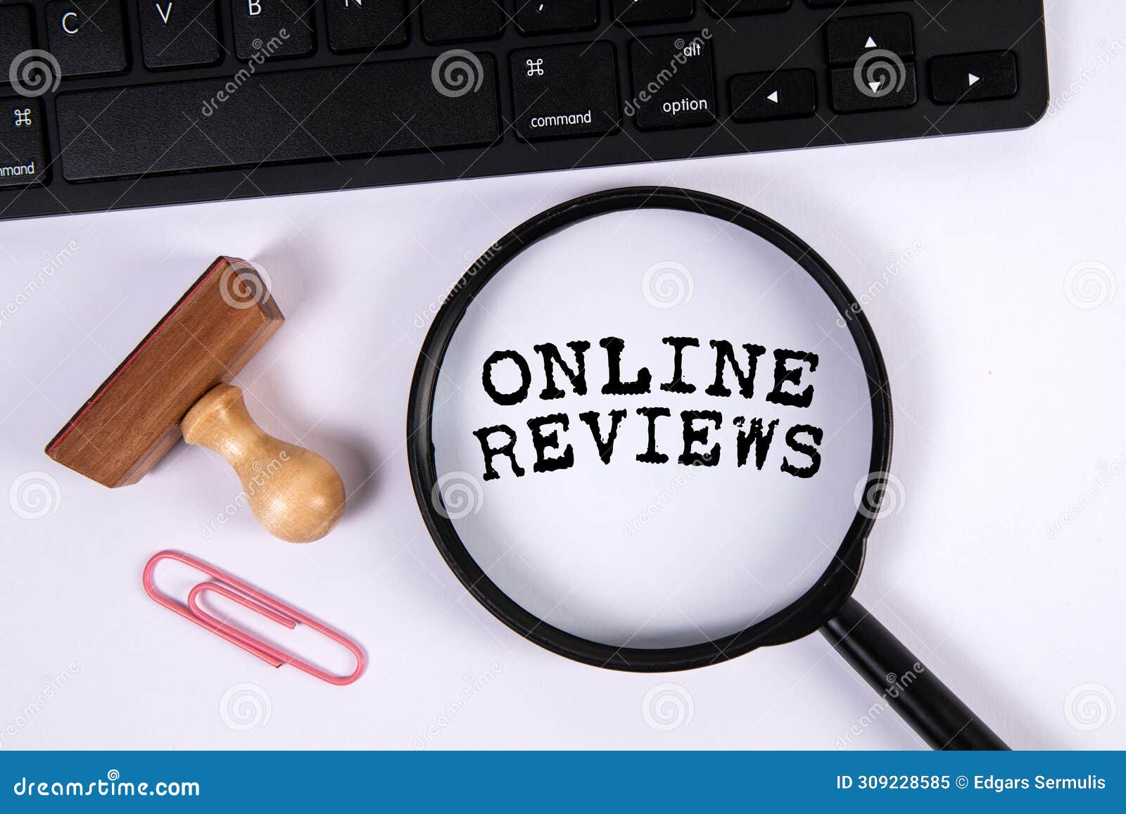 Online Reviews. Magnifying Glass and Computer Keyboard on White Office ...