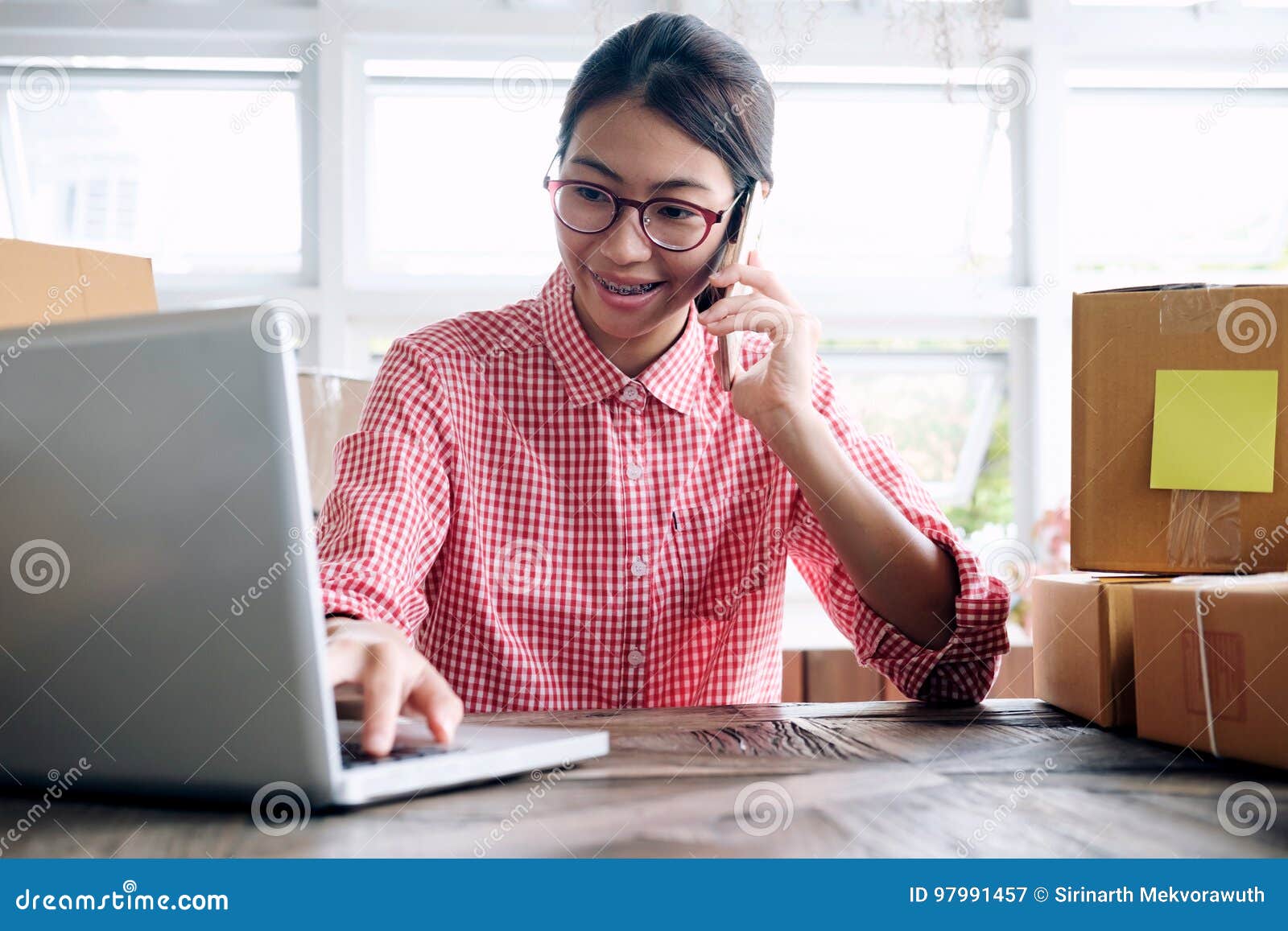 Online Seller Owner Using Computer for Checking Customer Orders. Stock ...