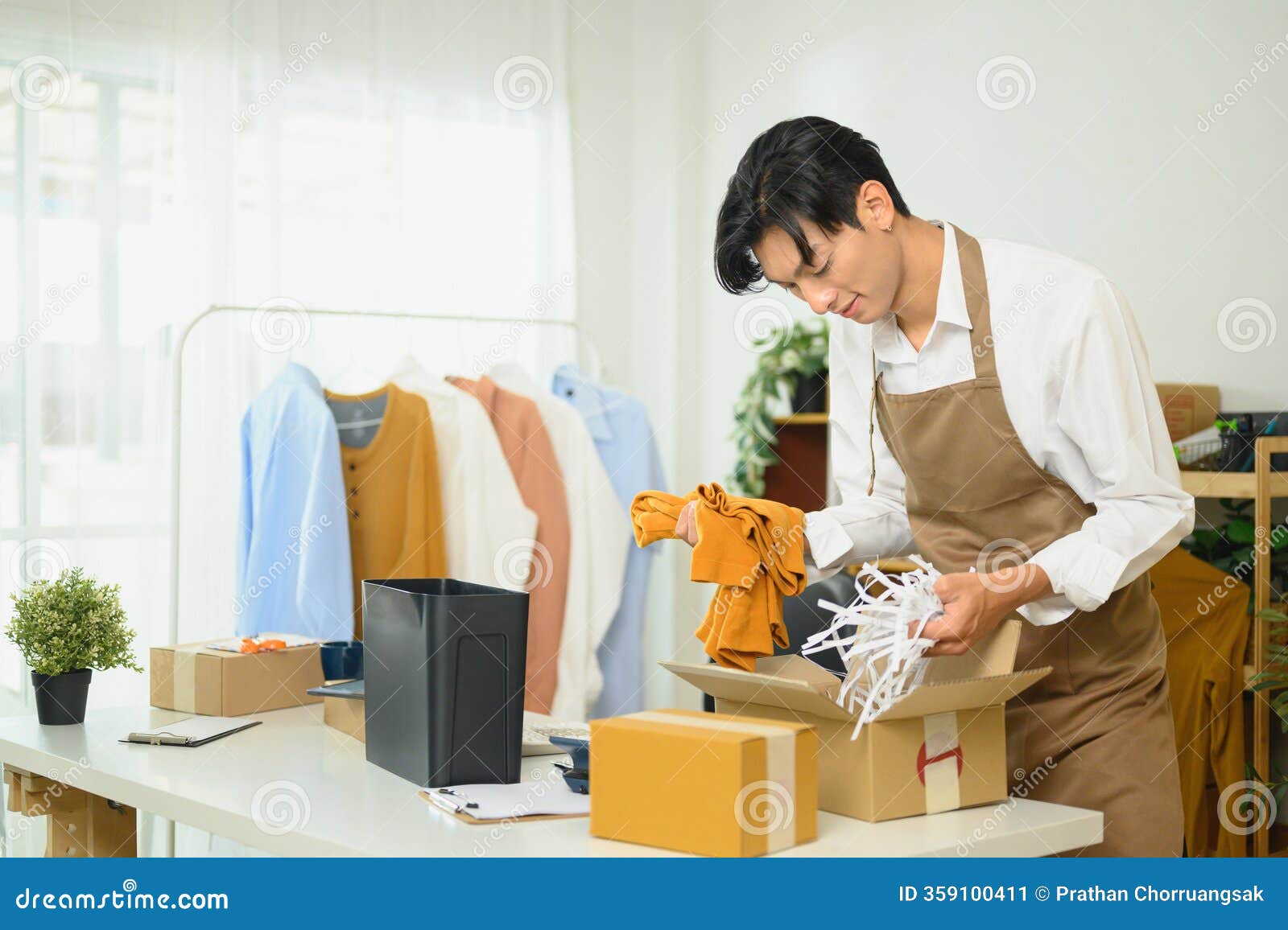 Online Seller Packaging a Customer Order in a Home Office Stock Image ...