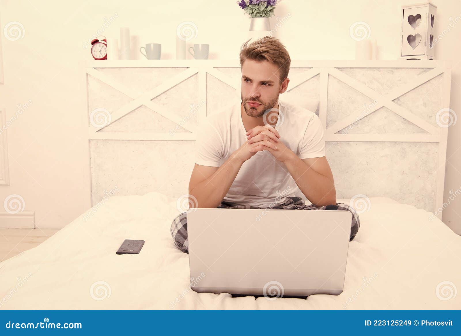 Online Work from Home Computer. Unshaven Man Use Laptop in Bed Stock ...