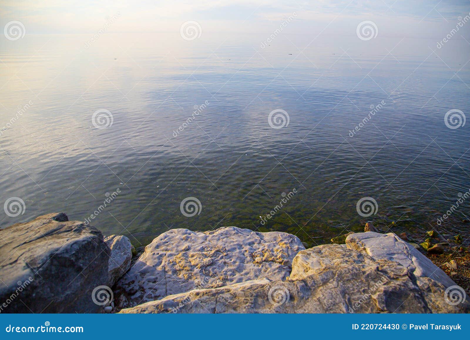 Ontario Lake in the Evening and Rocks Stock Photo - Image of evening ...