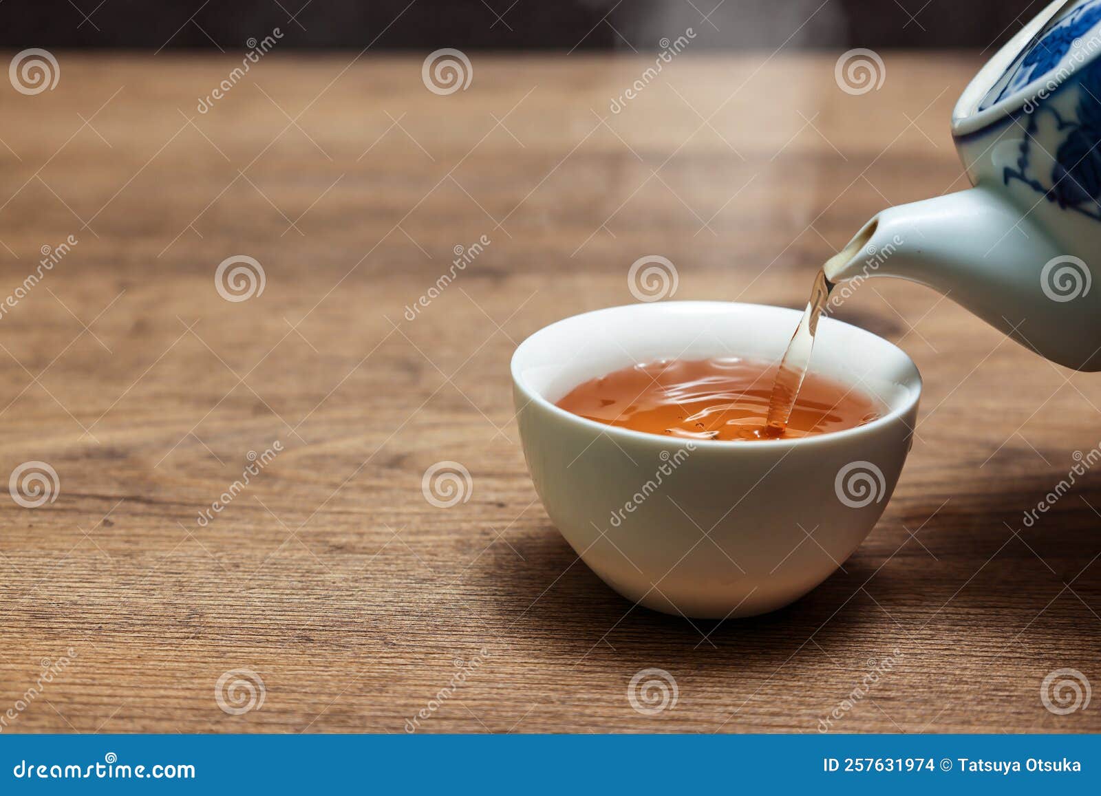 Oolong Tea Being Poured into a Teacup. Stock Photo - Image of break ...