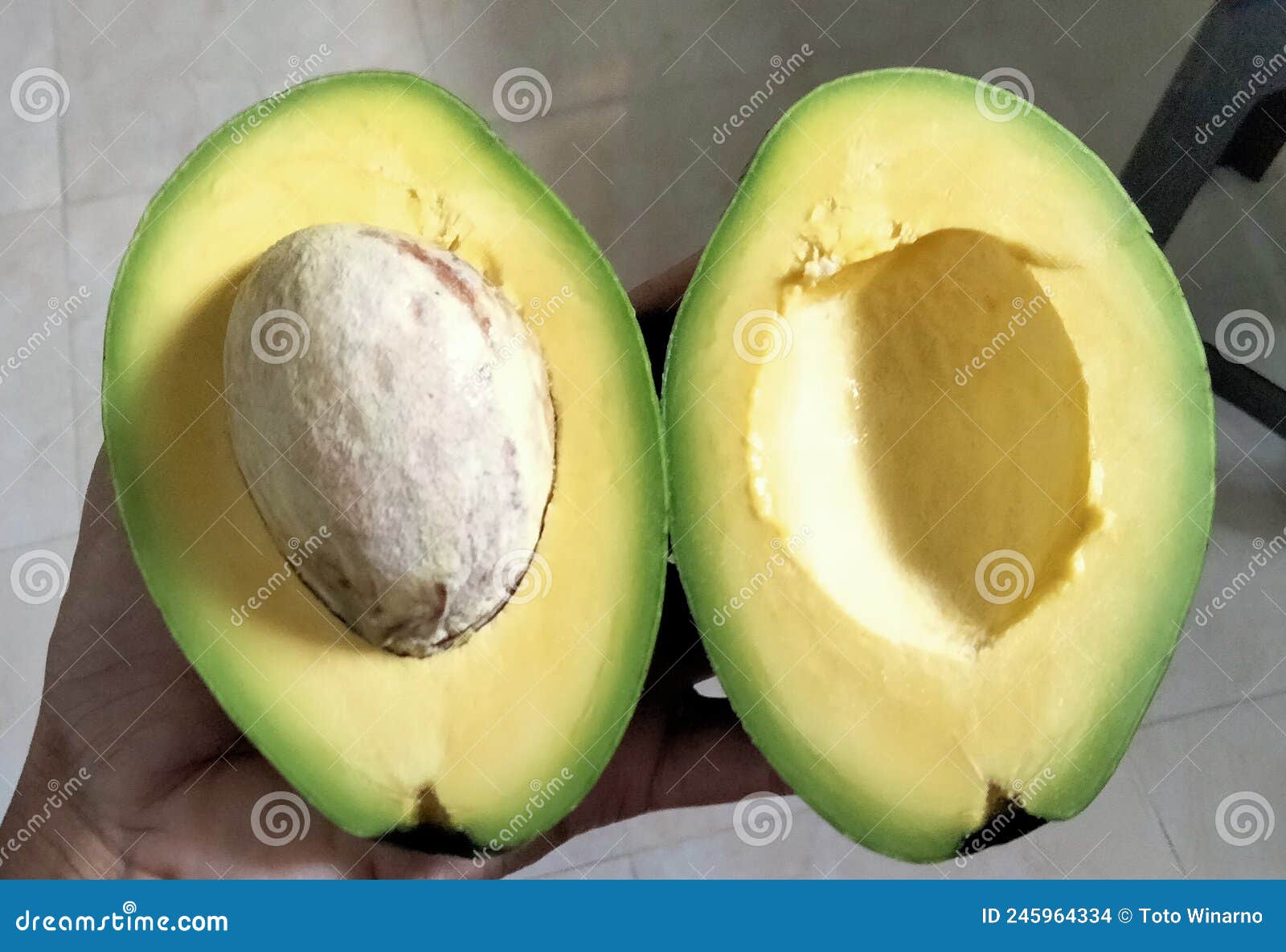 Open avocado with the seed stock photo. Image of area - 245964334