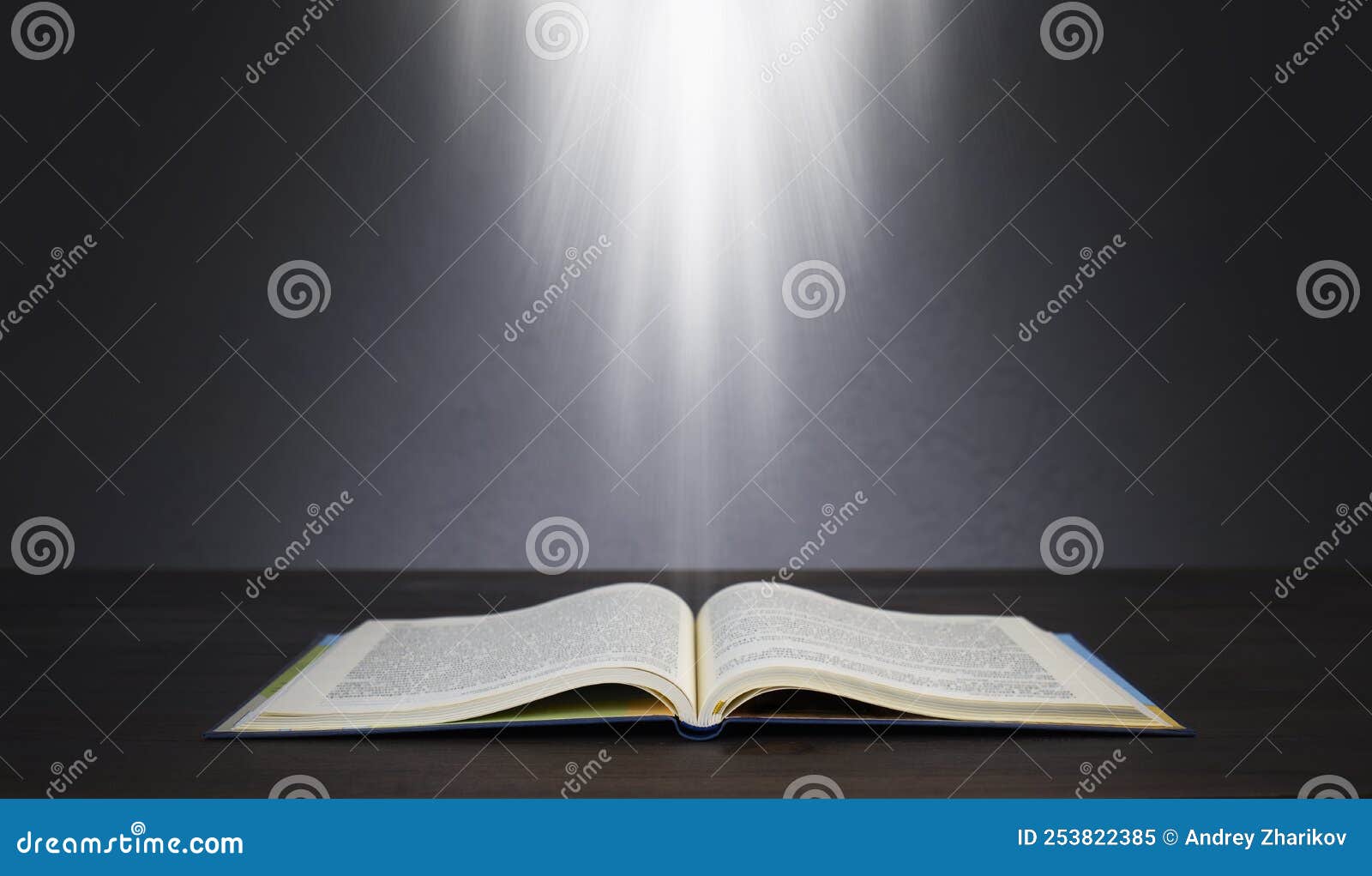 Open Bible. Holy Bible on the Table. Light from a Book. Stock Image ...