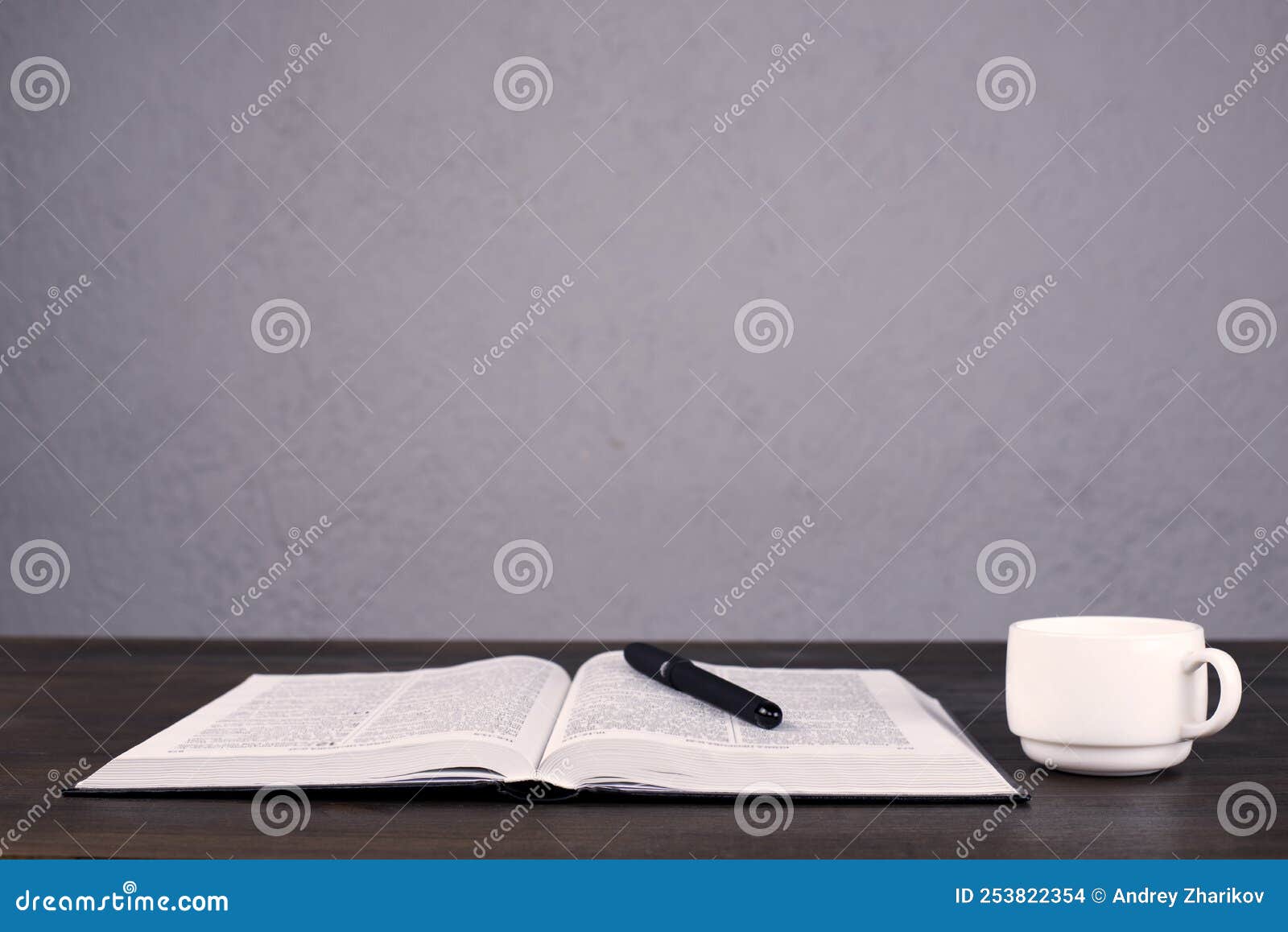 Open Bible. Holy Bible on the Table. Pen and Notepad. Cup White Stock ...