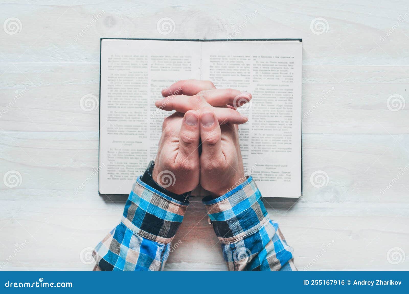 Open Bible Prayer. the Man S Hands are Folded and Praying. Holy ...