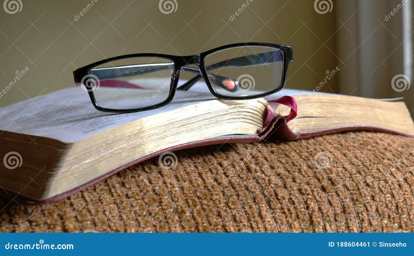 Open Bible with Spectacles or Reading Glasses on Top of it. Stock Video ...